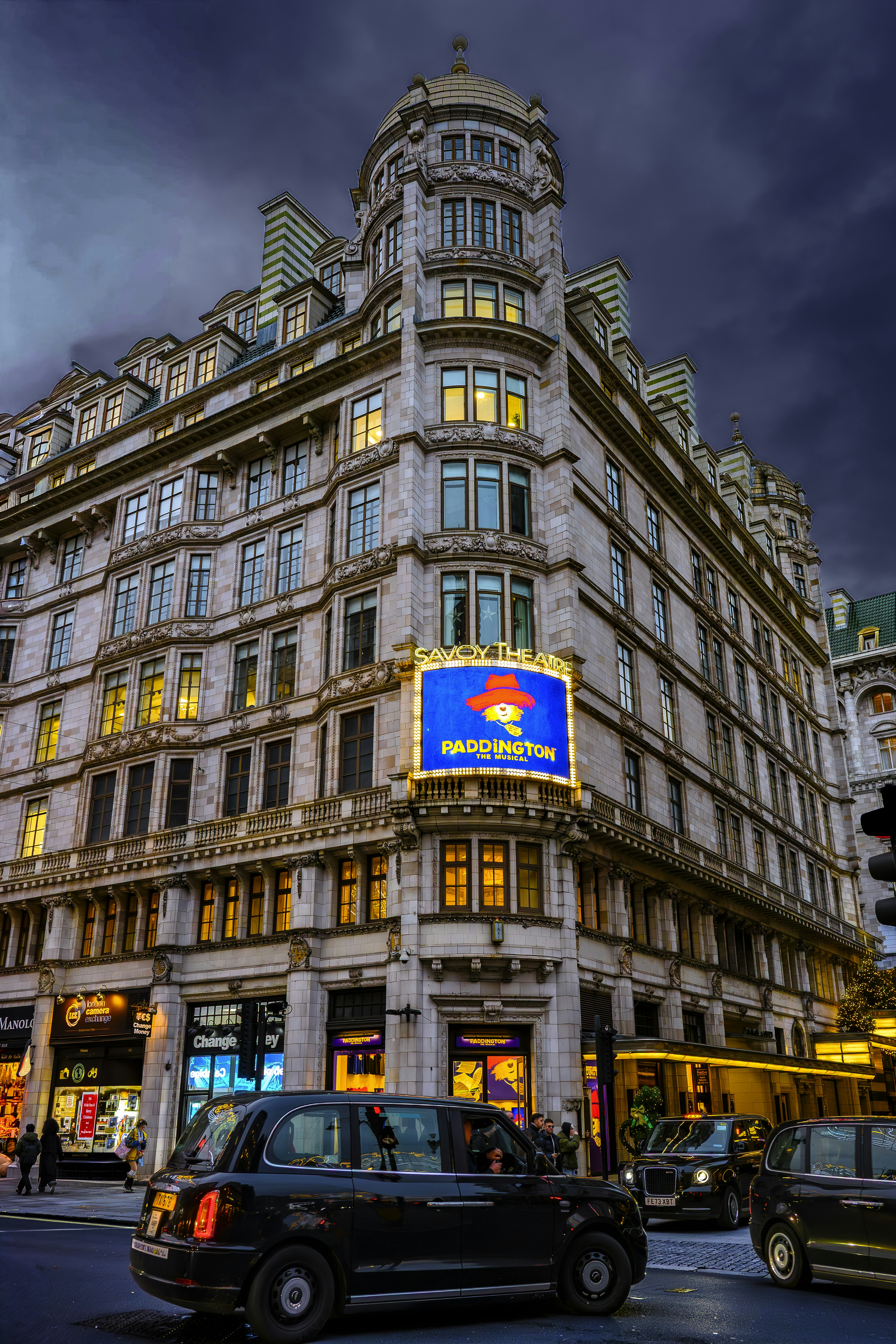 Neon Signage on a Cornered Stone Facade: Paddington at Dusk