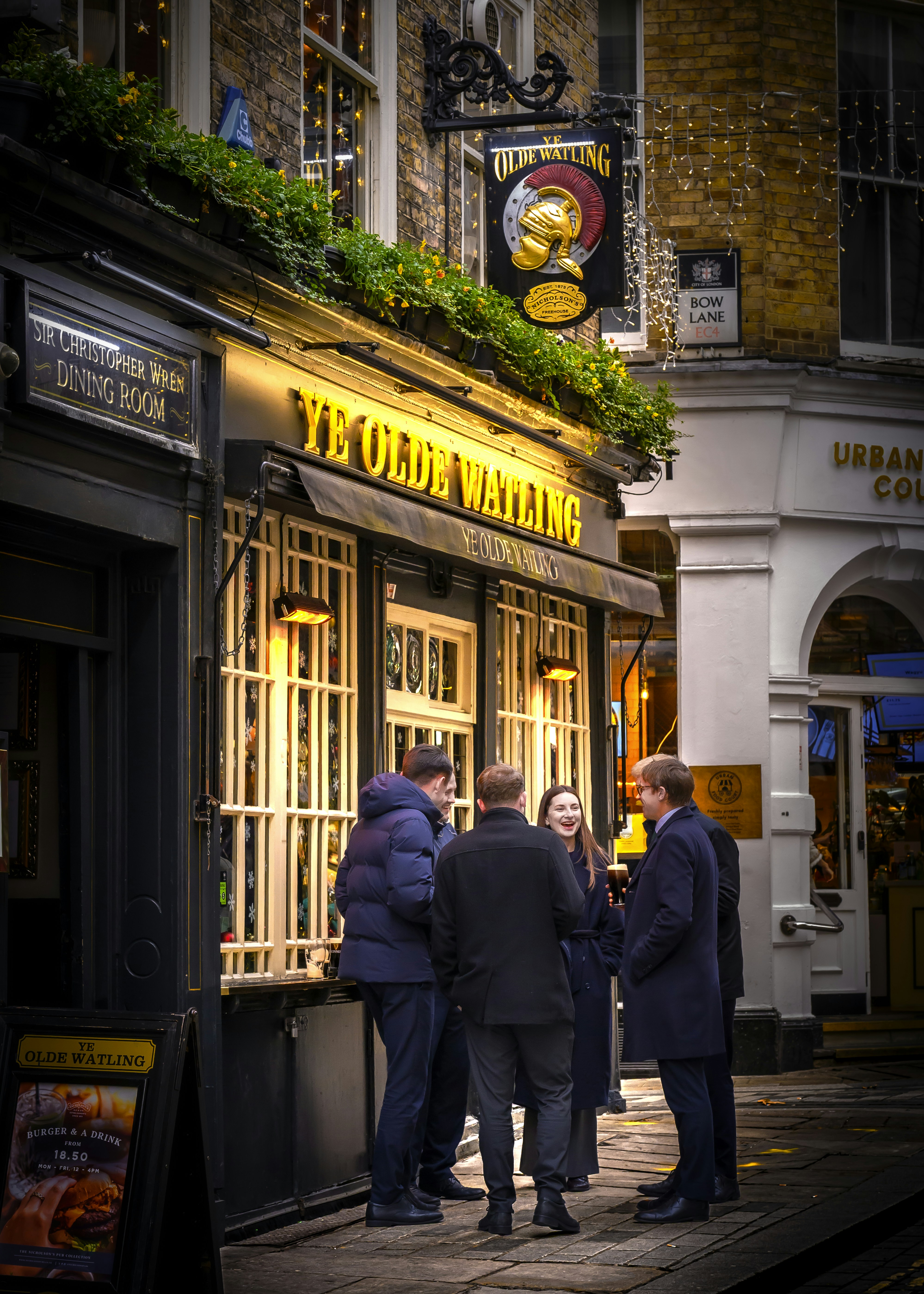Gathered in a Cozy Soho Talk Outside Ye Olde Watling