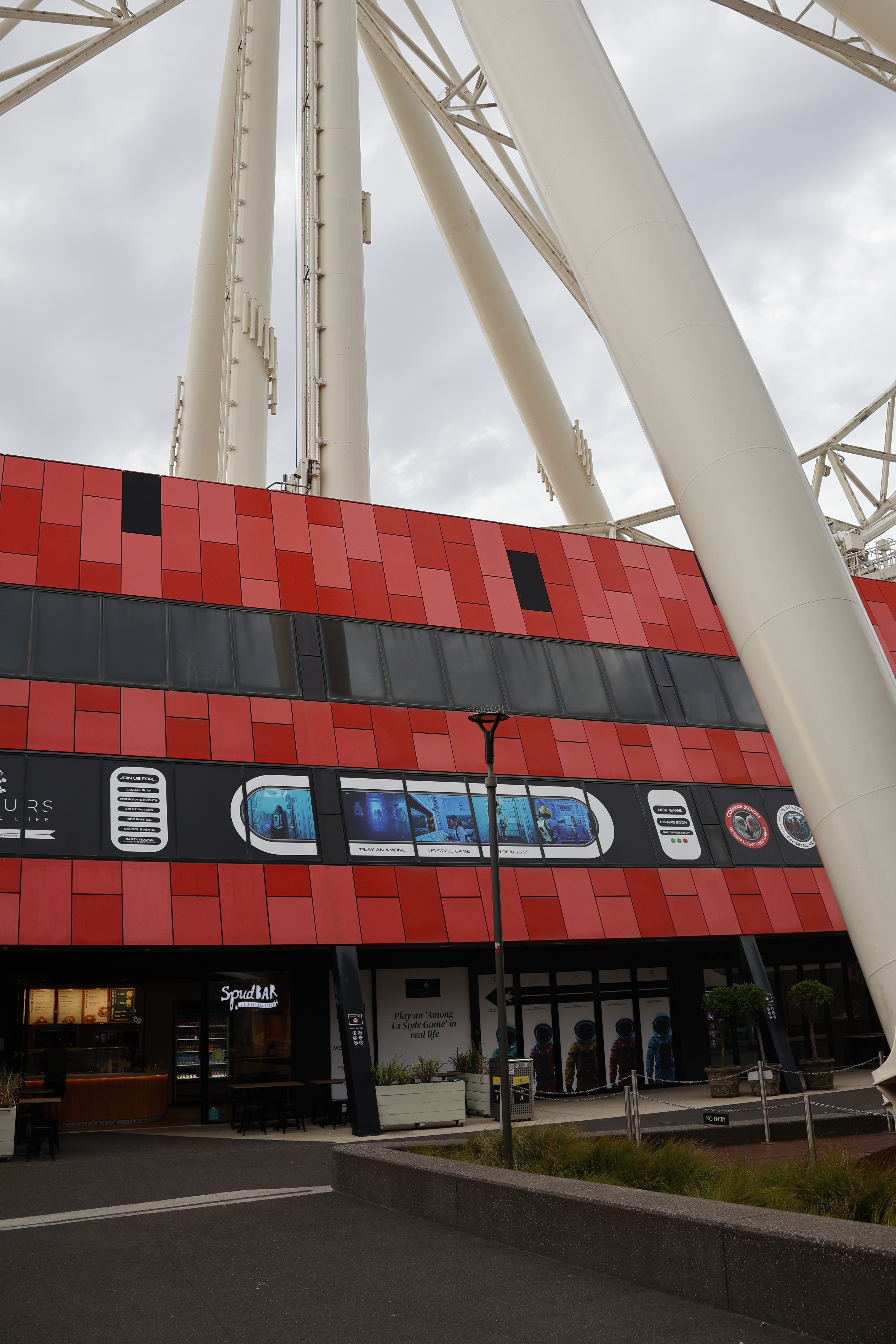 Red Facade, White Steel: A Modern Transport Hub Under Struts