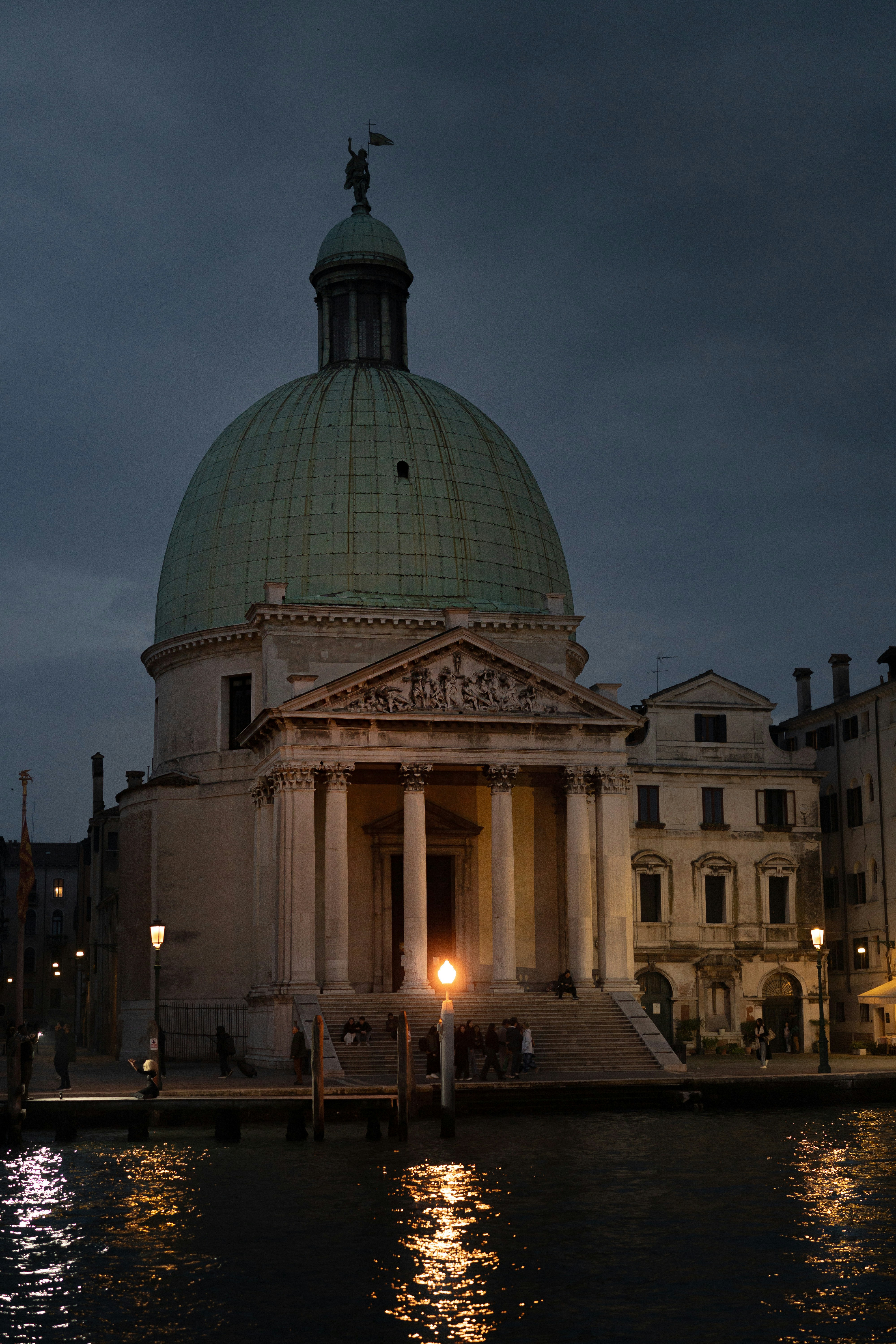 Lights on the Steps: The Basilica by the Canal at Dusk