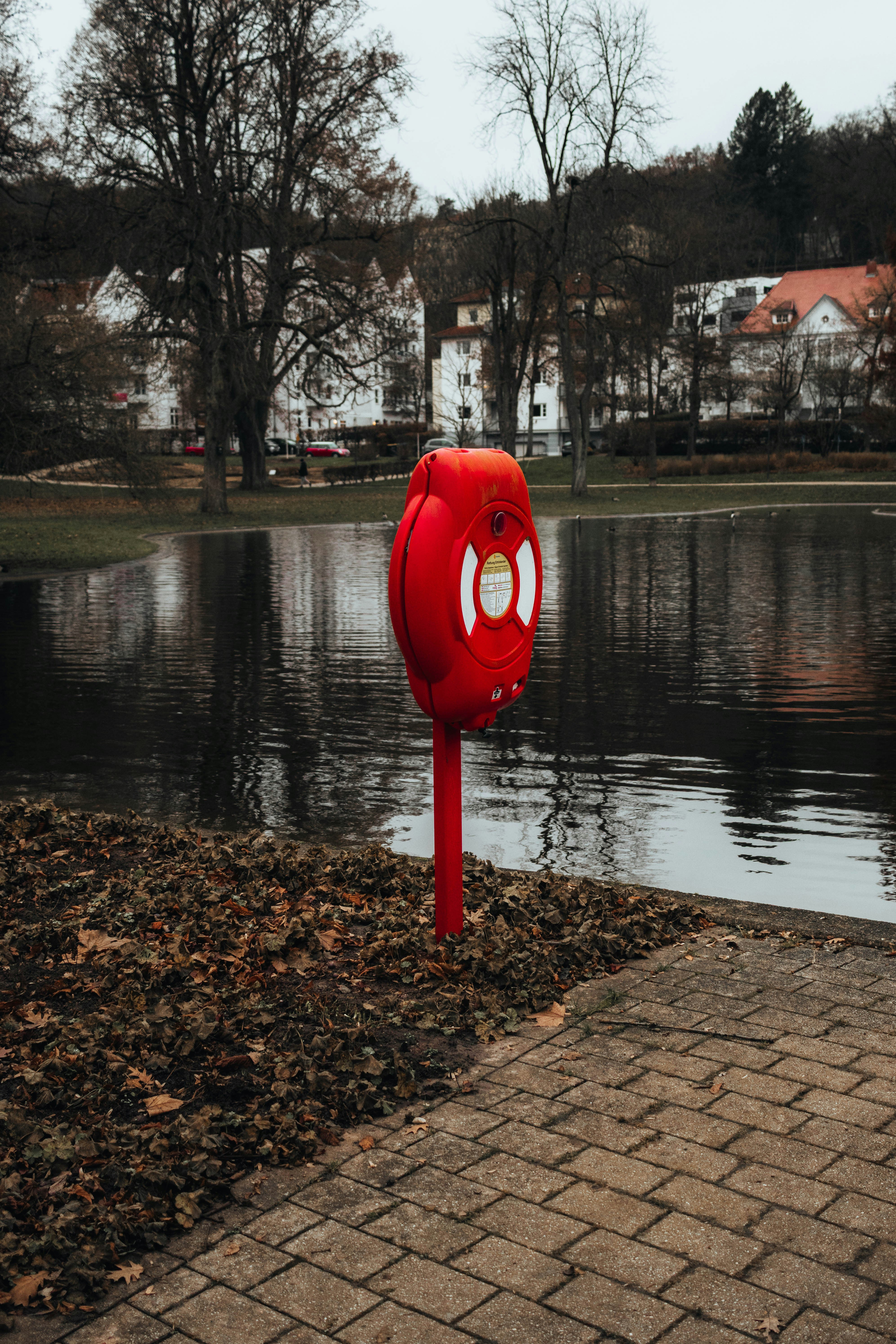 Red Lifebuoy by the Pier: A Quiet Moment on a Winter Waterside
