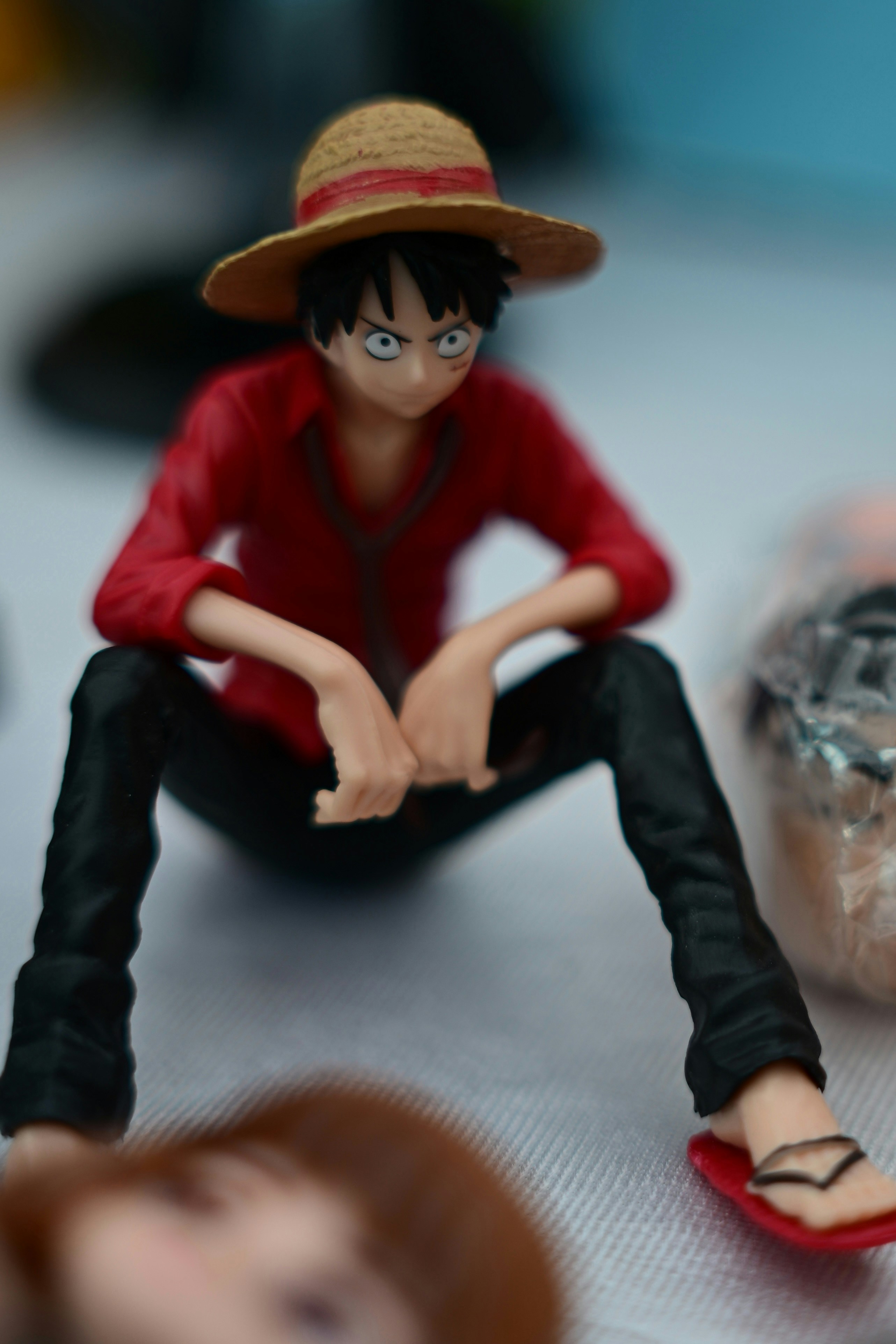 Lone Straw Hat Figure in Blurred Studio Quietude