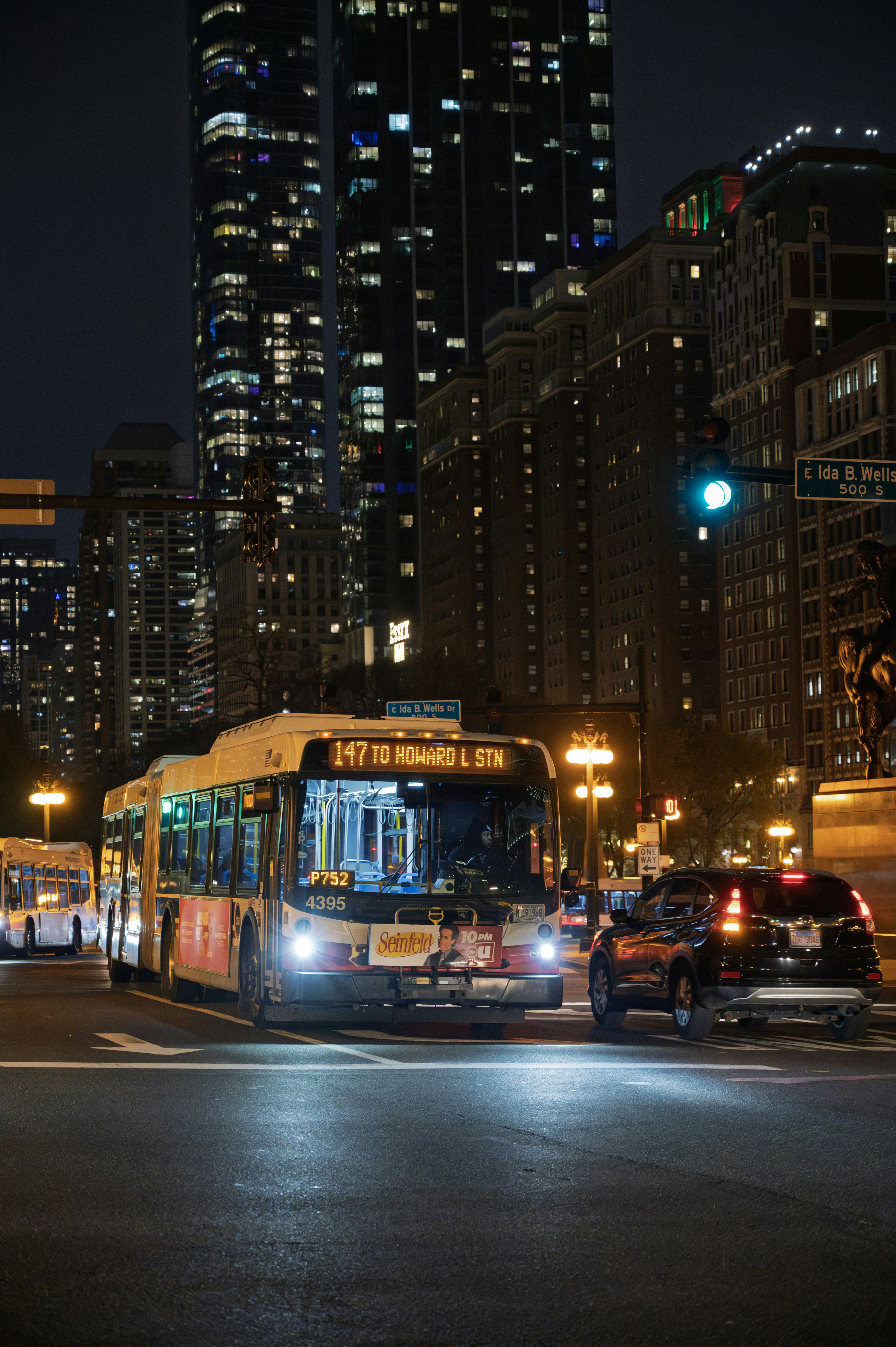 Neon City Bus at Night: Traffic Pulse Under Tall Glass