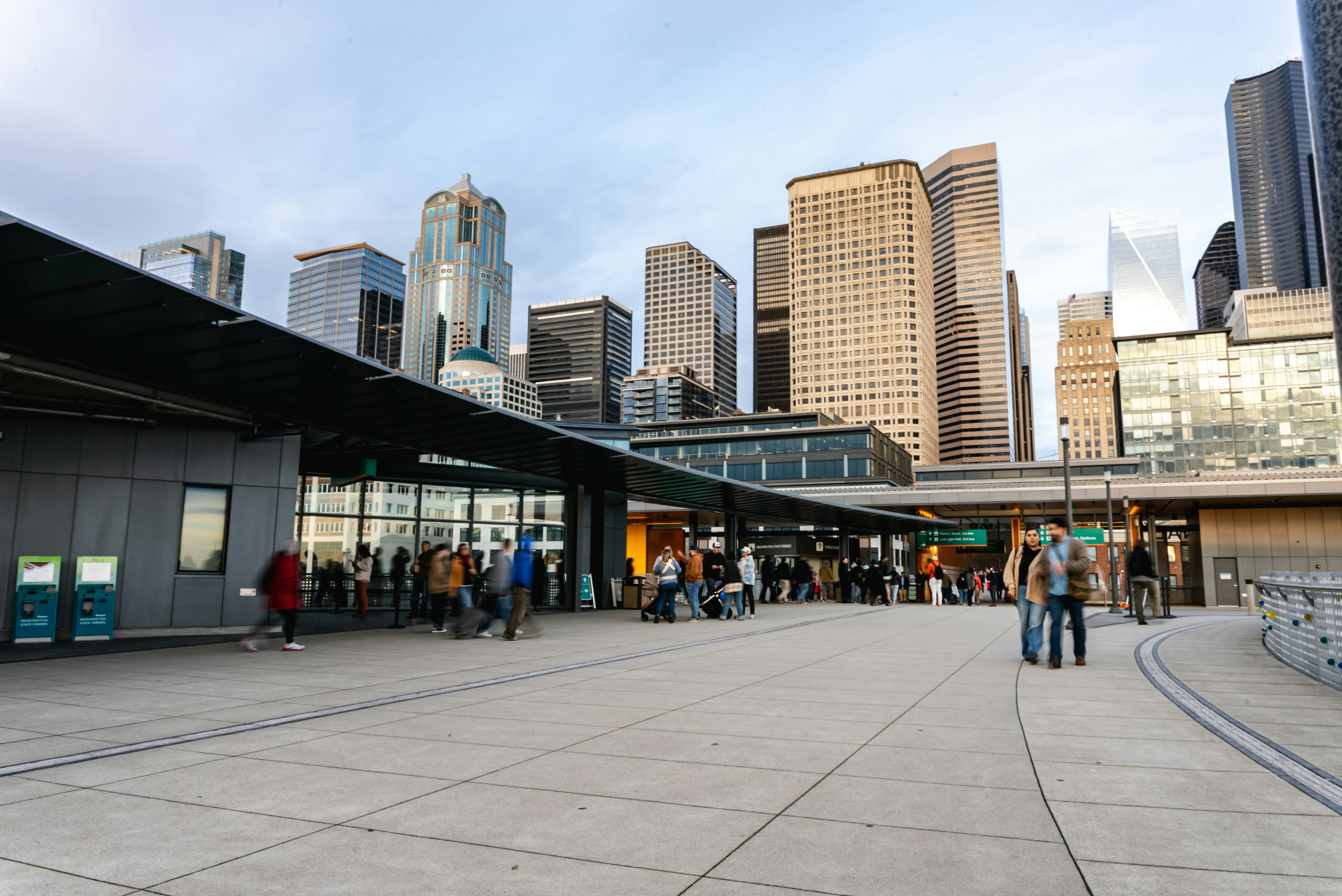People walk near modern buildings in a city. photo – Free Cityscape ...