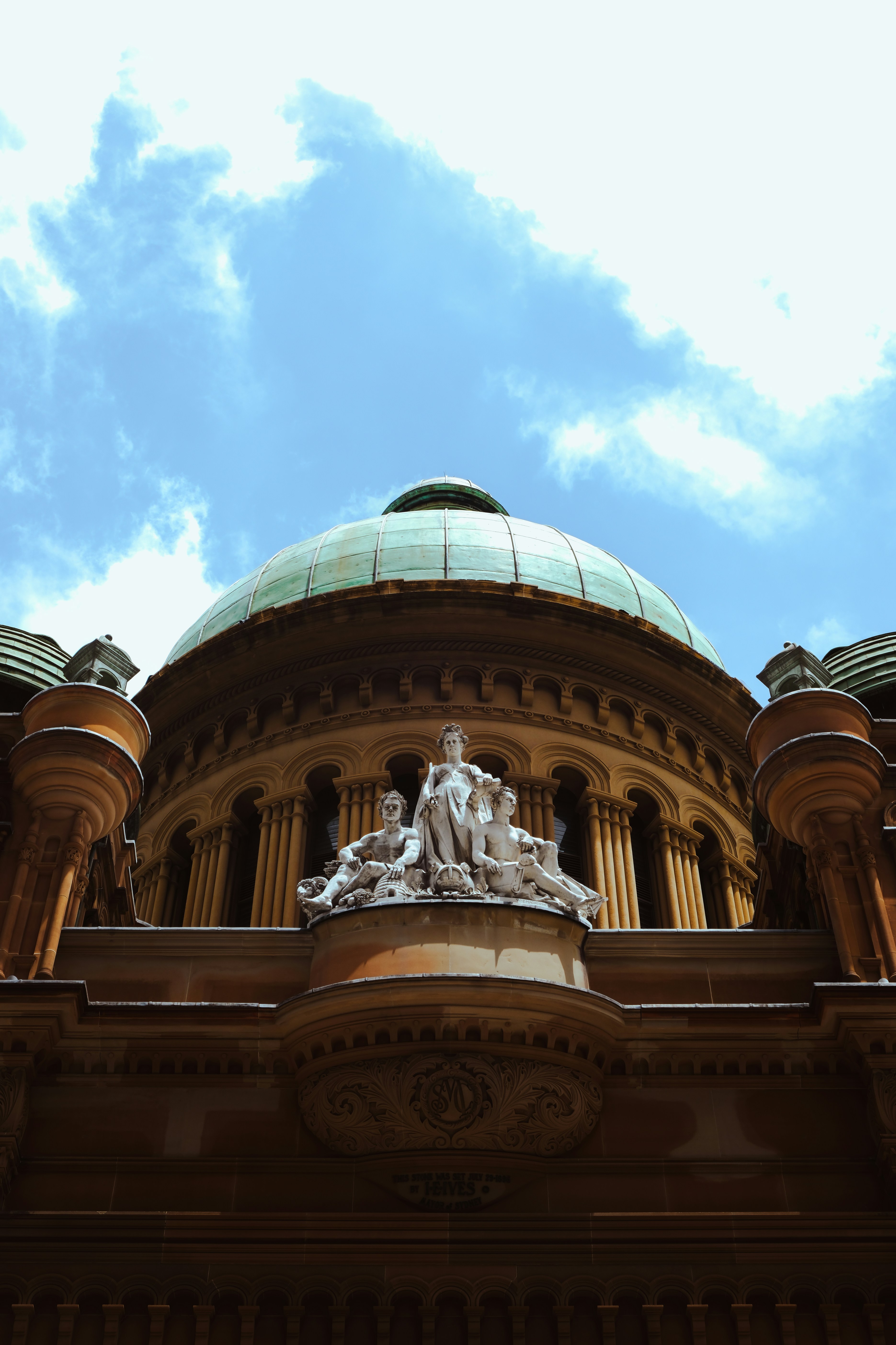 Stone Dome Serenade: Sculpted Figures Guard the Grand Facade
