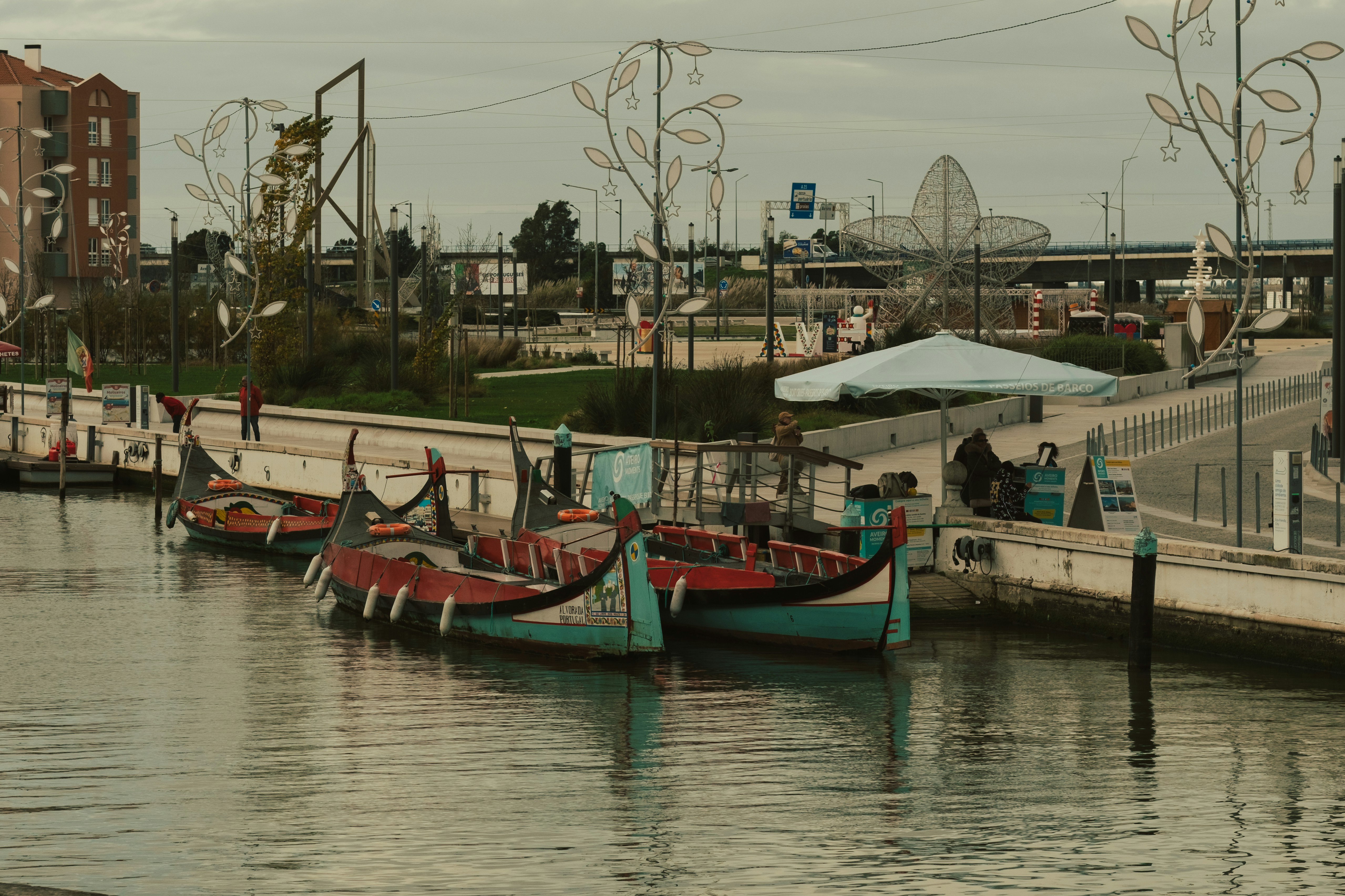 Boats Docked by the Modern Riverside Promenade