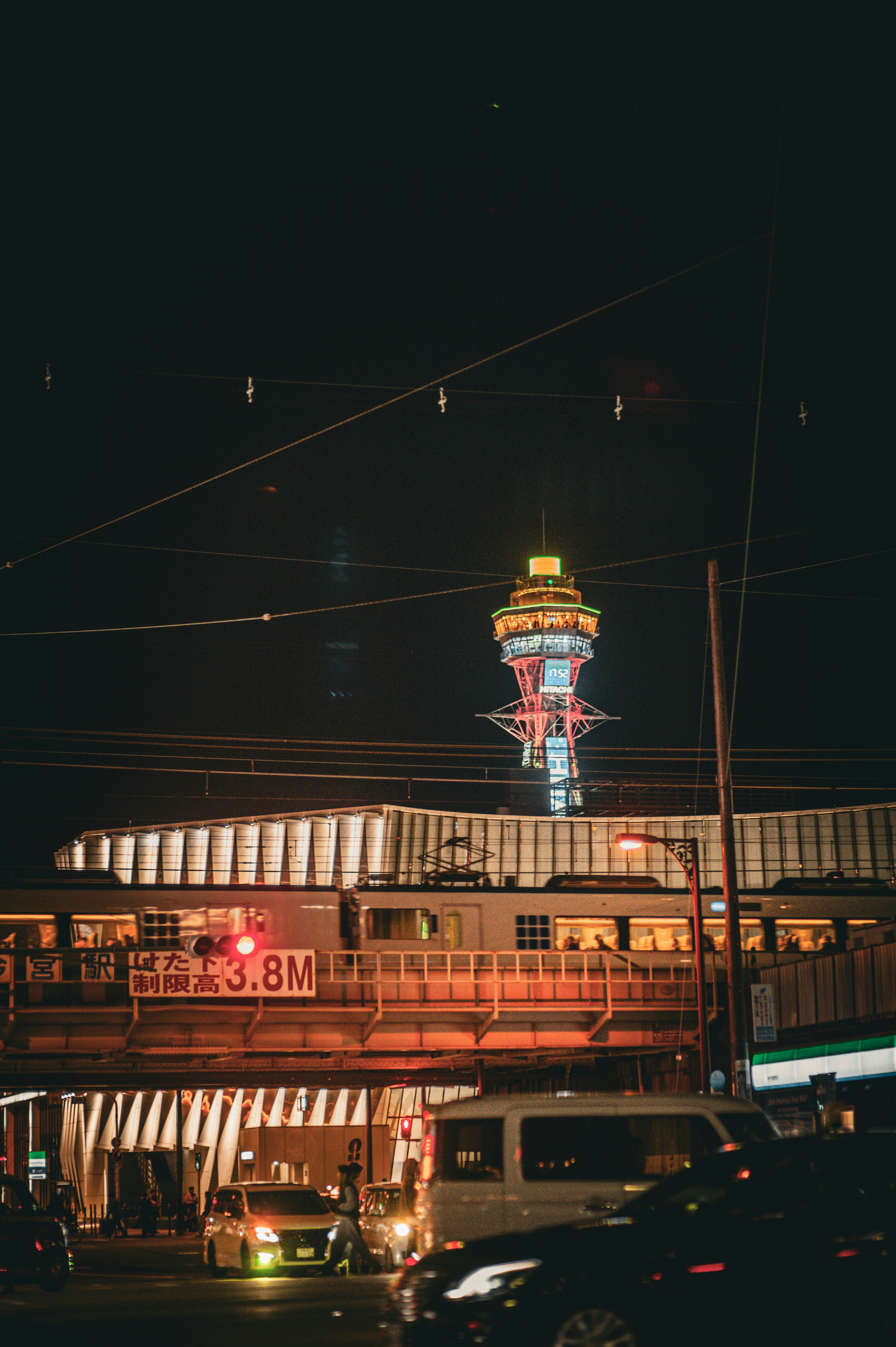 Night City Tower Glow Over a Busy Overpass