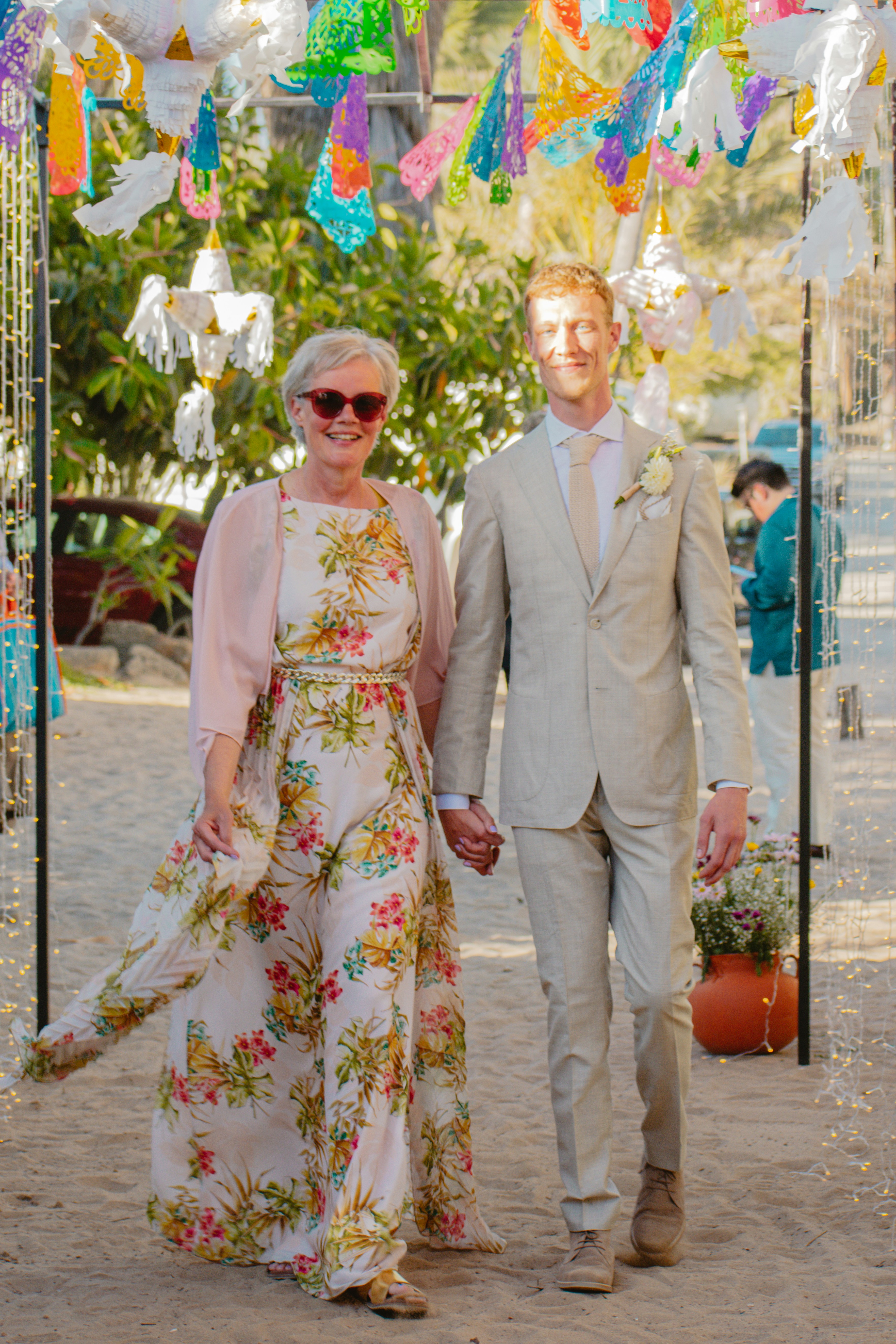 Walk of Joy: Bridegroom and Mother in a Sunlit Garden Ceremony
