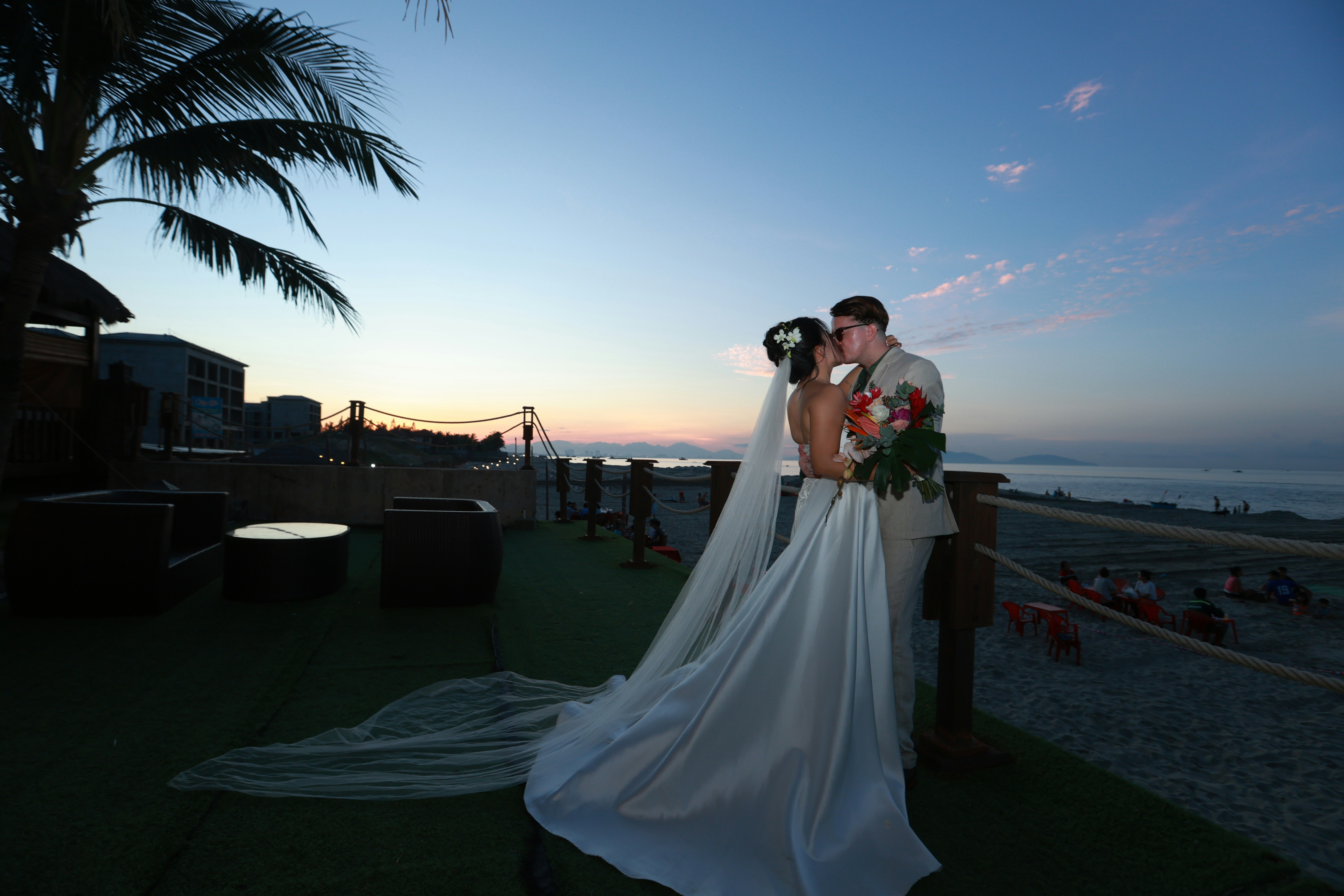 Sunset Vows: A Kiss on the Beach Night-Glow