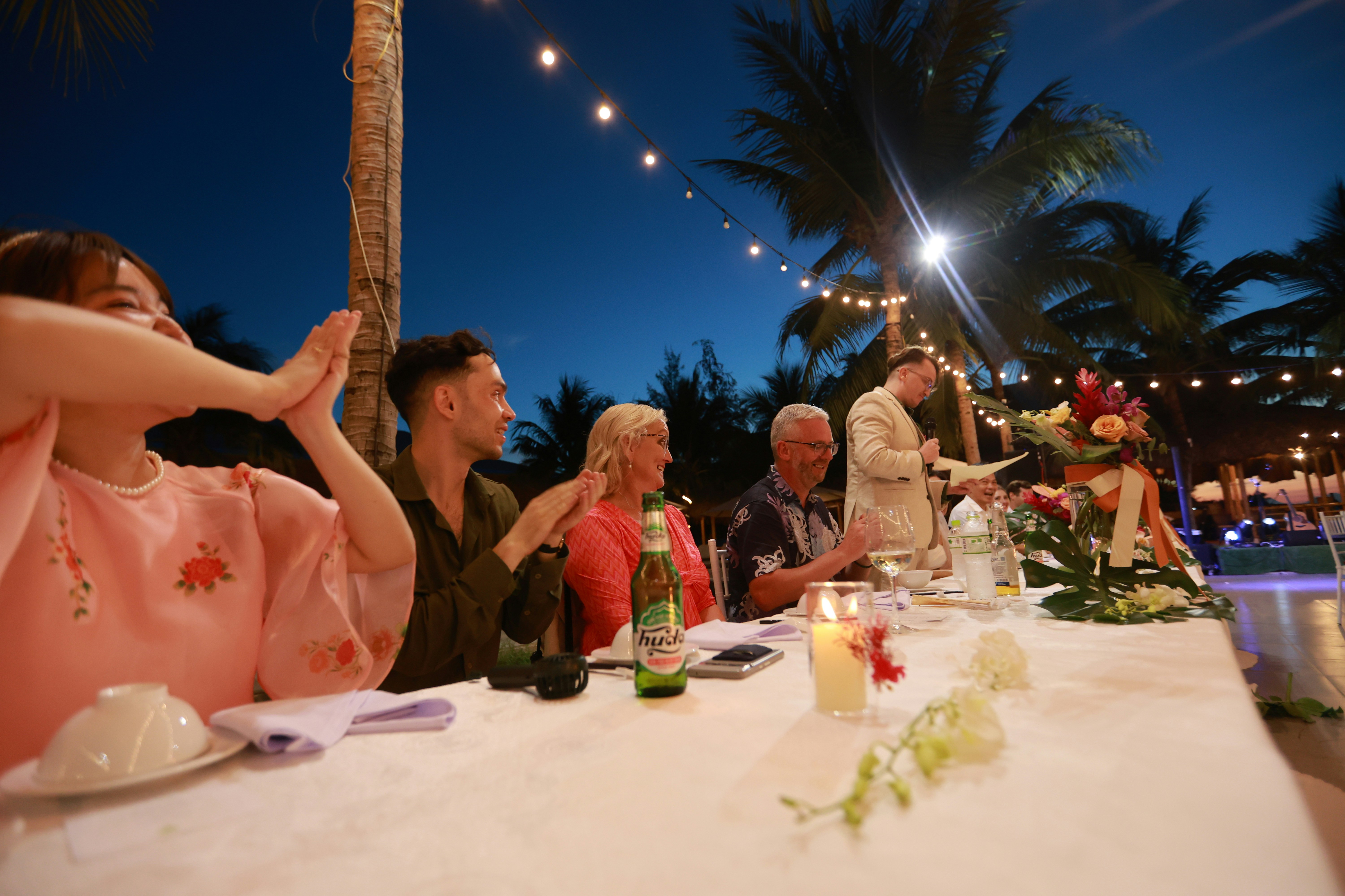 Evening Toast Under Festoon Lights