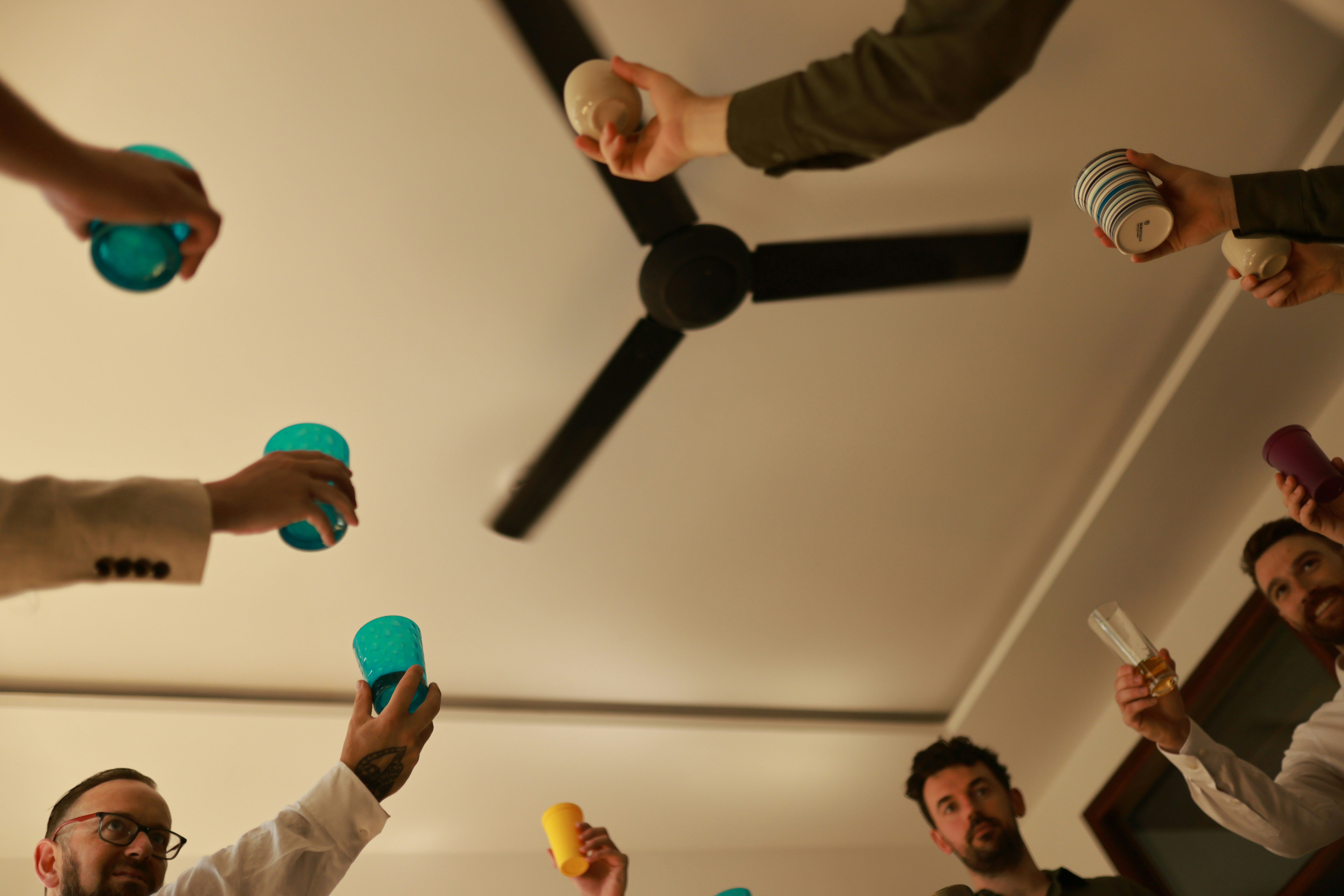 Circle of Toasts: A Ground-Up Cheers under a Ceiling Fan