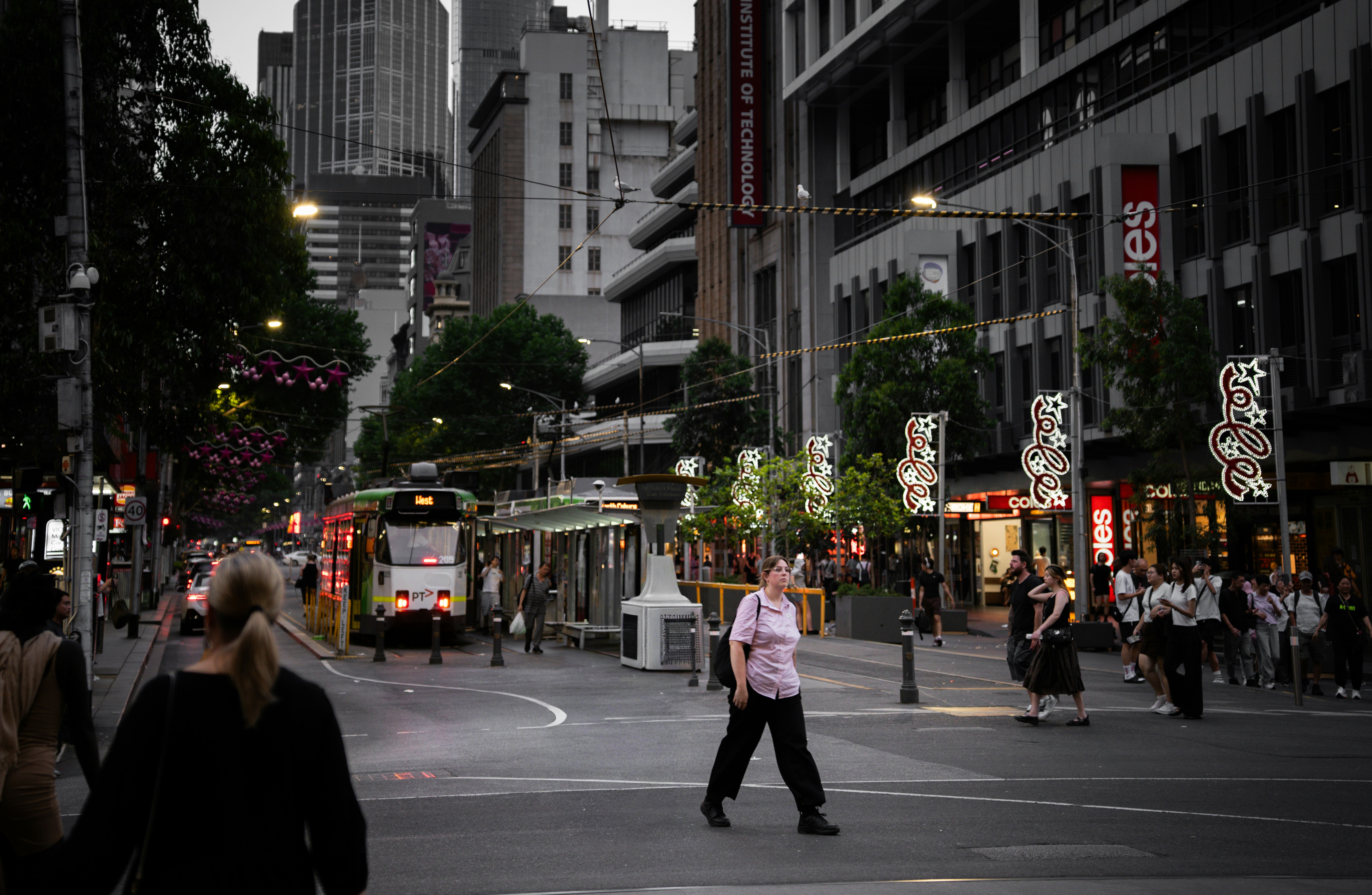 Crosswalk Pulse: A Busy City Moment Under Evening Lights