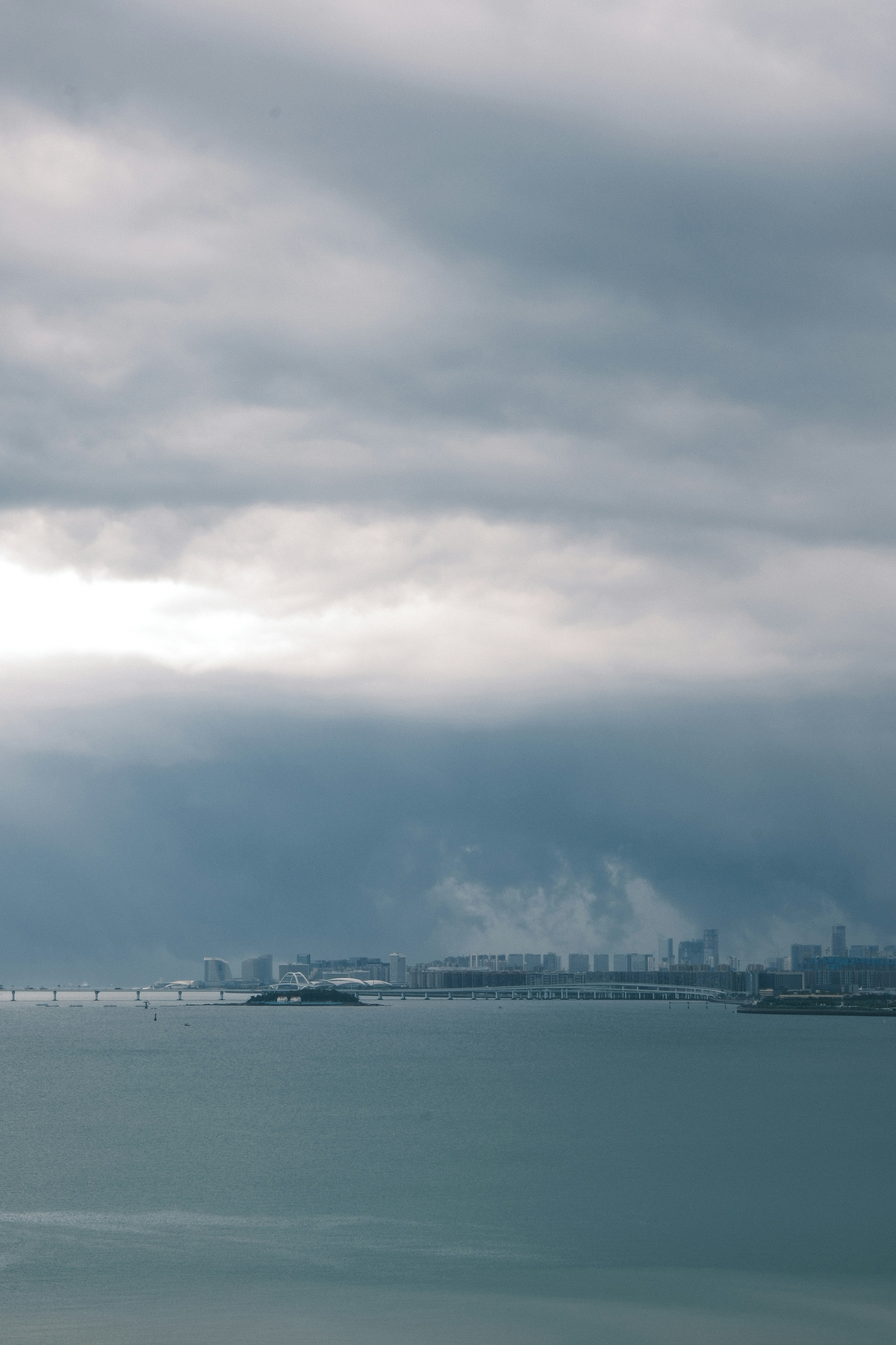 Steel Horizon: City Pier Amid Stormy Skies