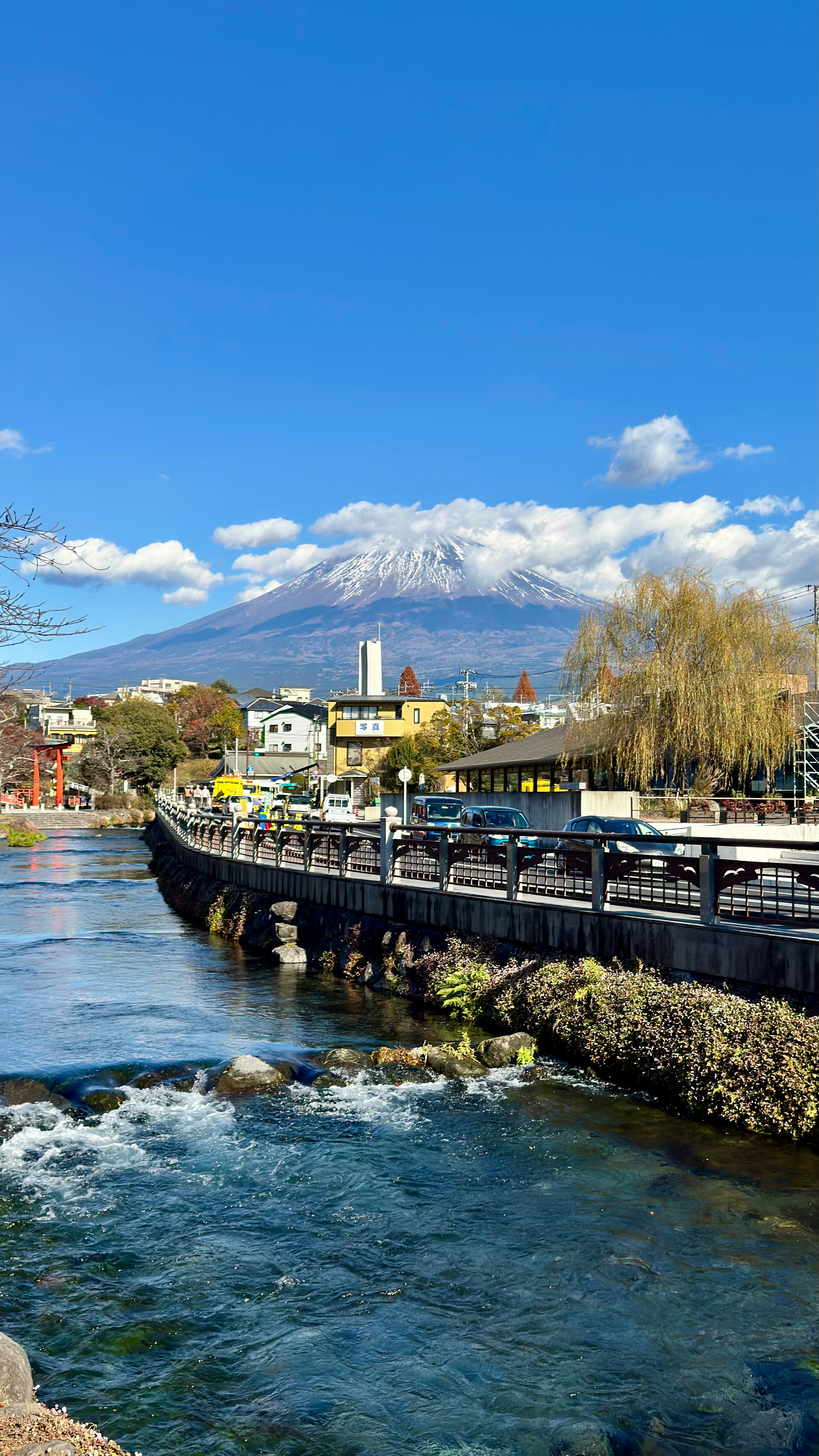 Mt. Fuji's Riverside: Sky, Street, and Stream