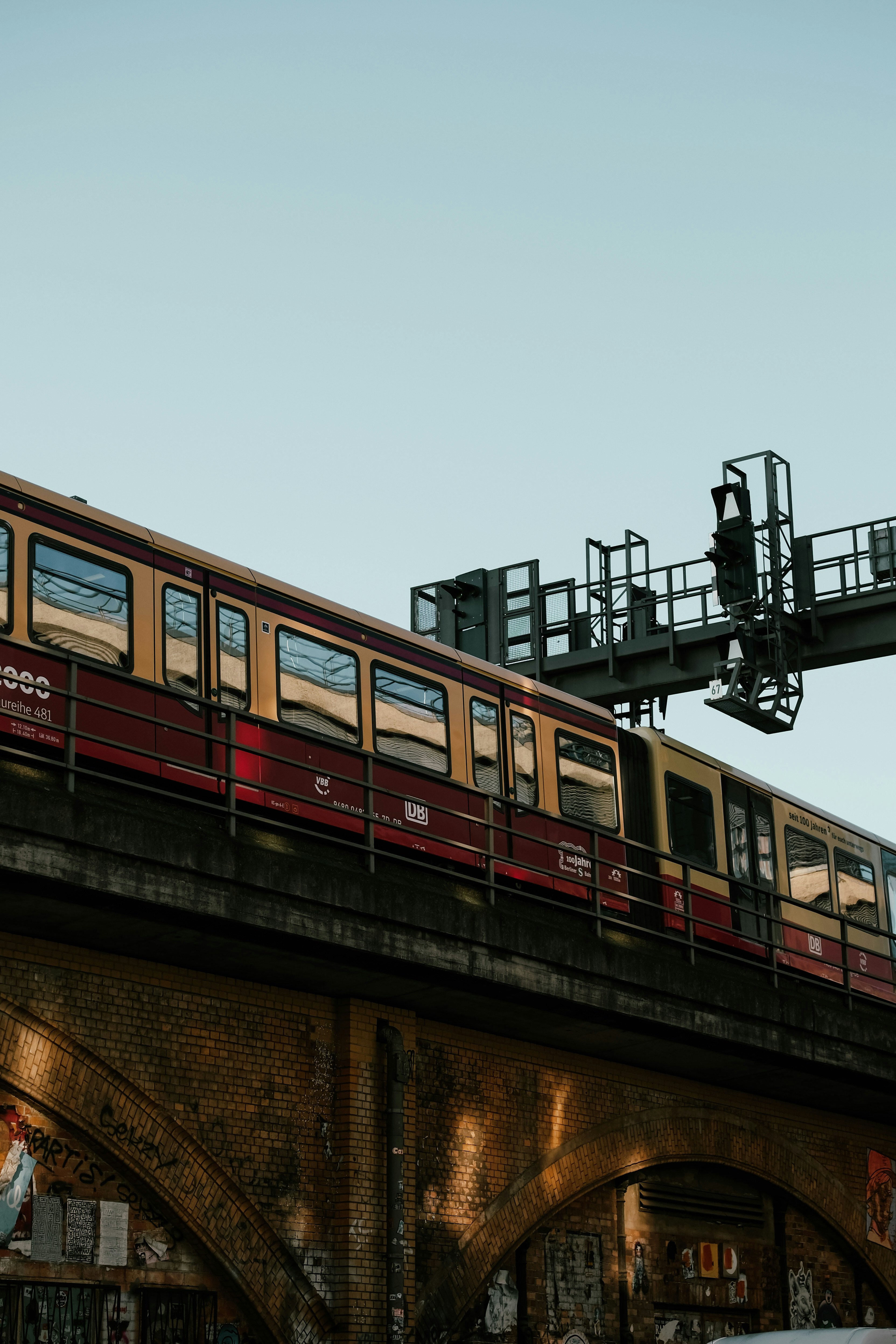 Subway Carriage Crossing the Bridge Above Graffiti-Lined Arch