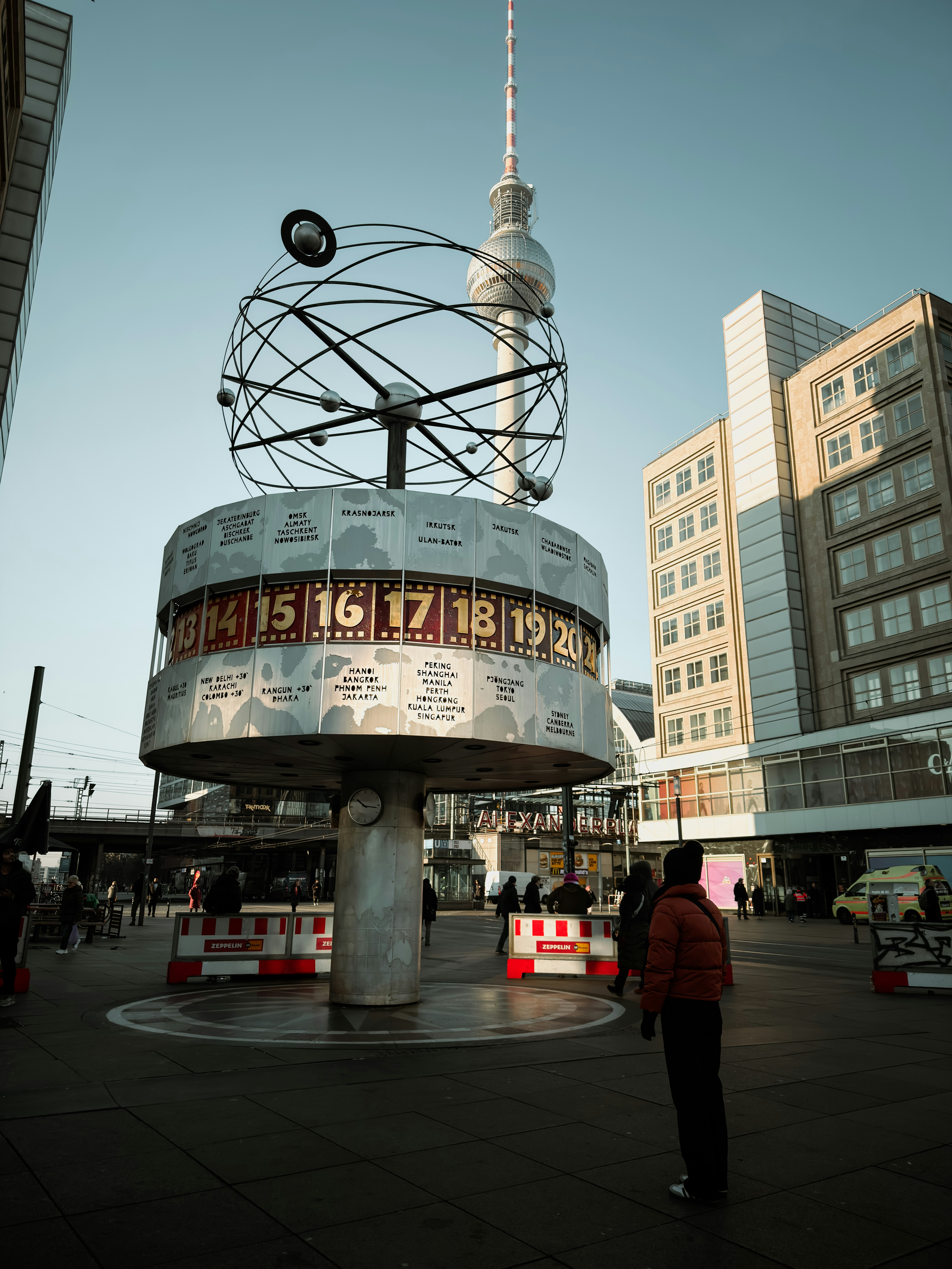 World clock tower with buildings in the backgroundMaria Molnarova