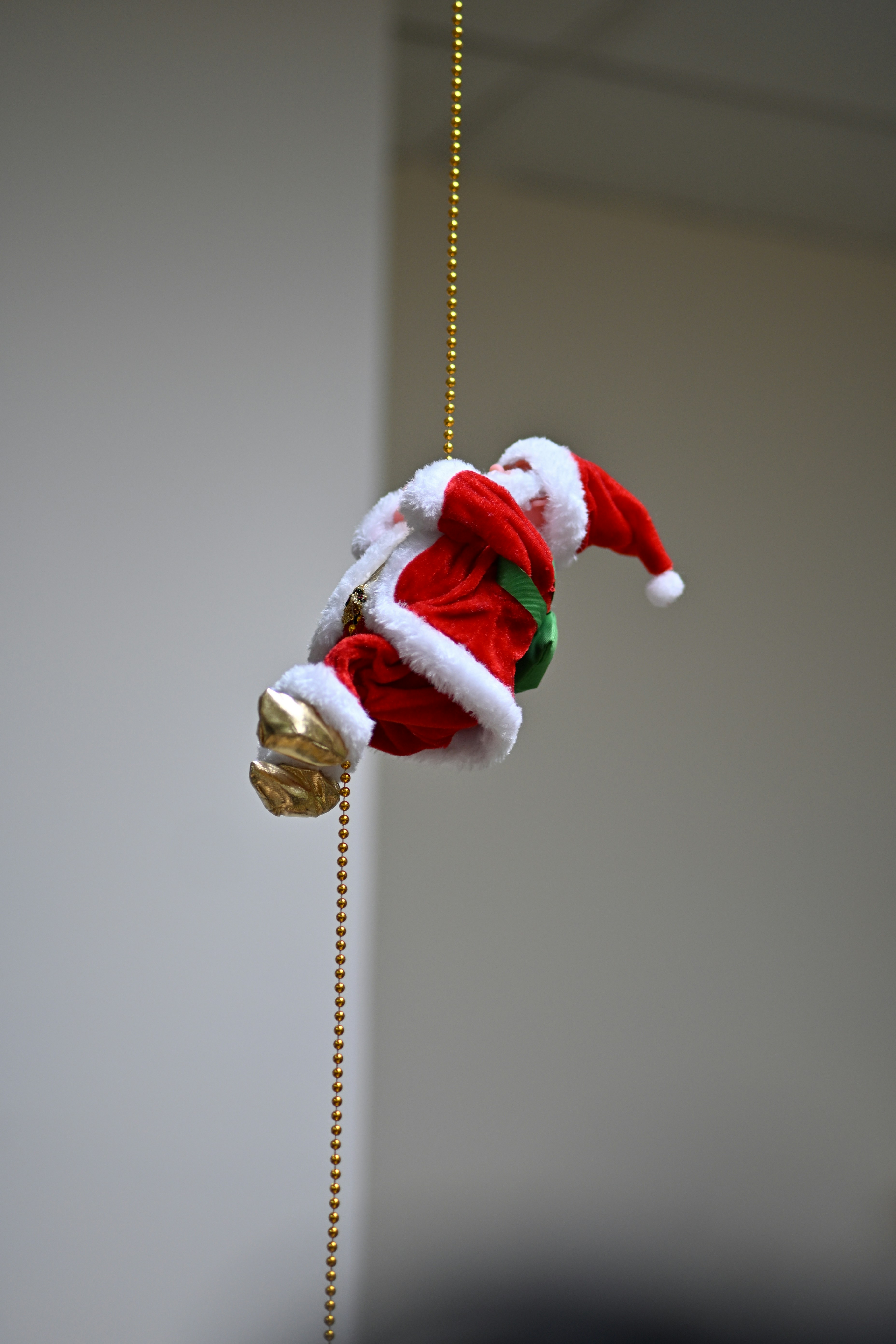 Floating Santa: A Tiny Ornament Cling to a Metallic Beaded Line