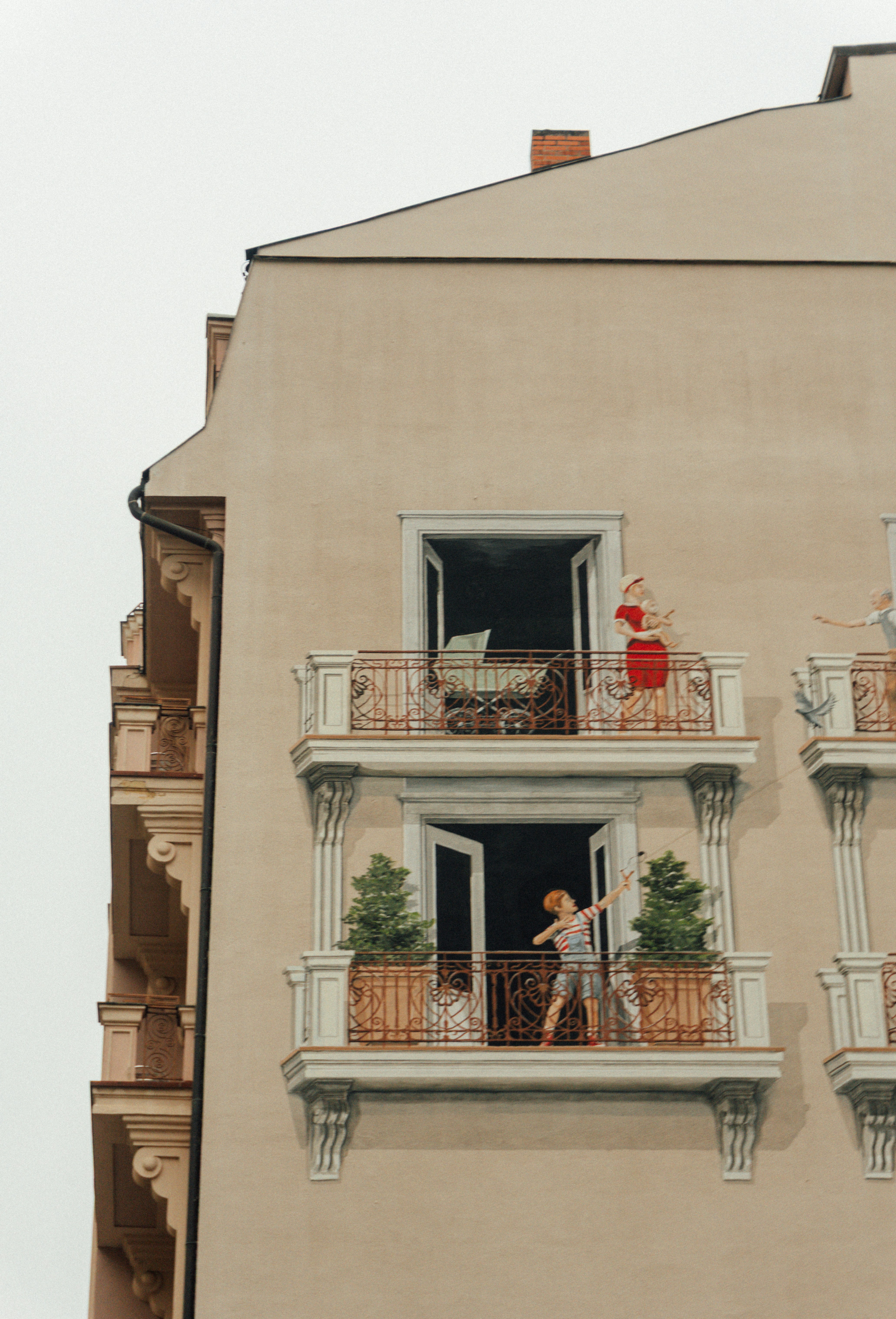 Balcony Parade: A Sunlit Moment on a Sunlit Facade