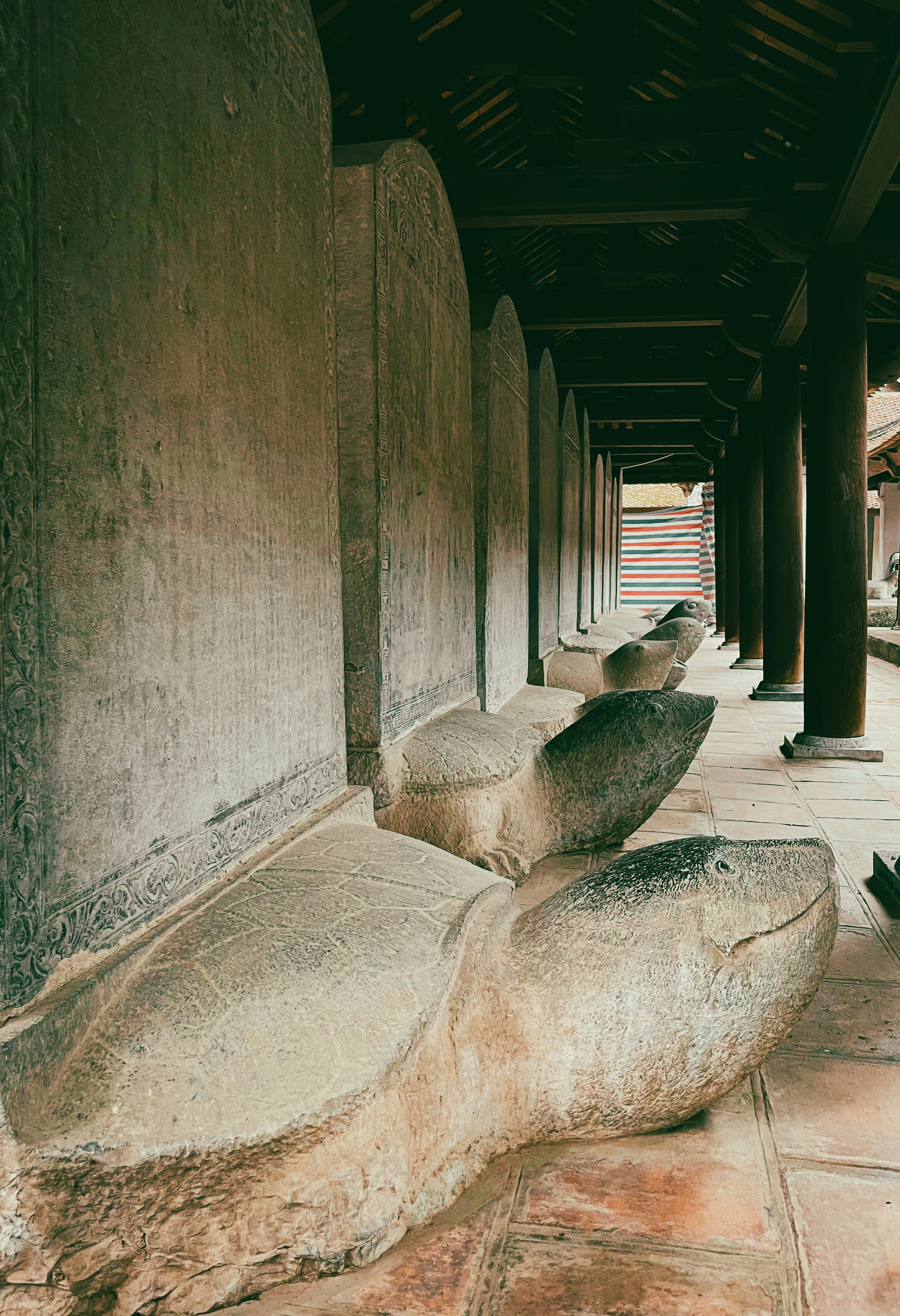 Stone Carved Seats in a Silent Corridor
