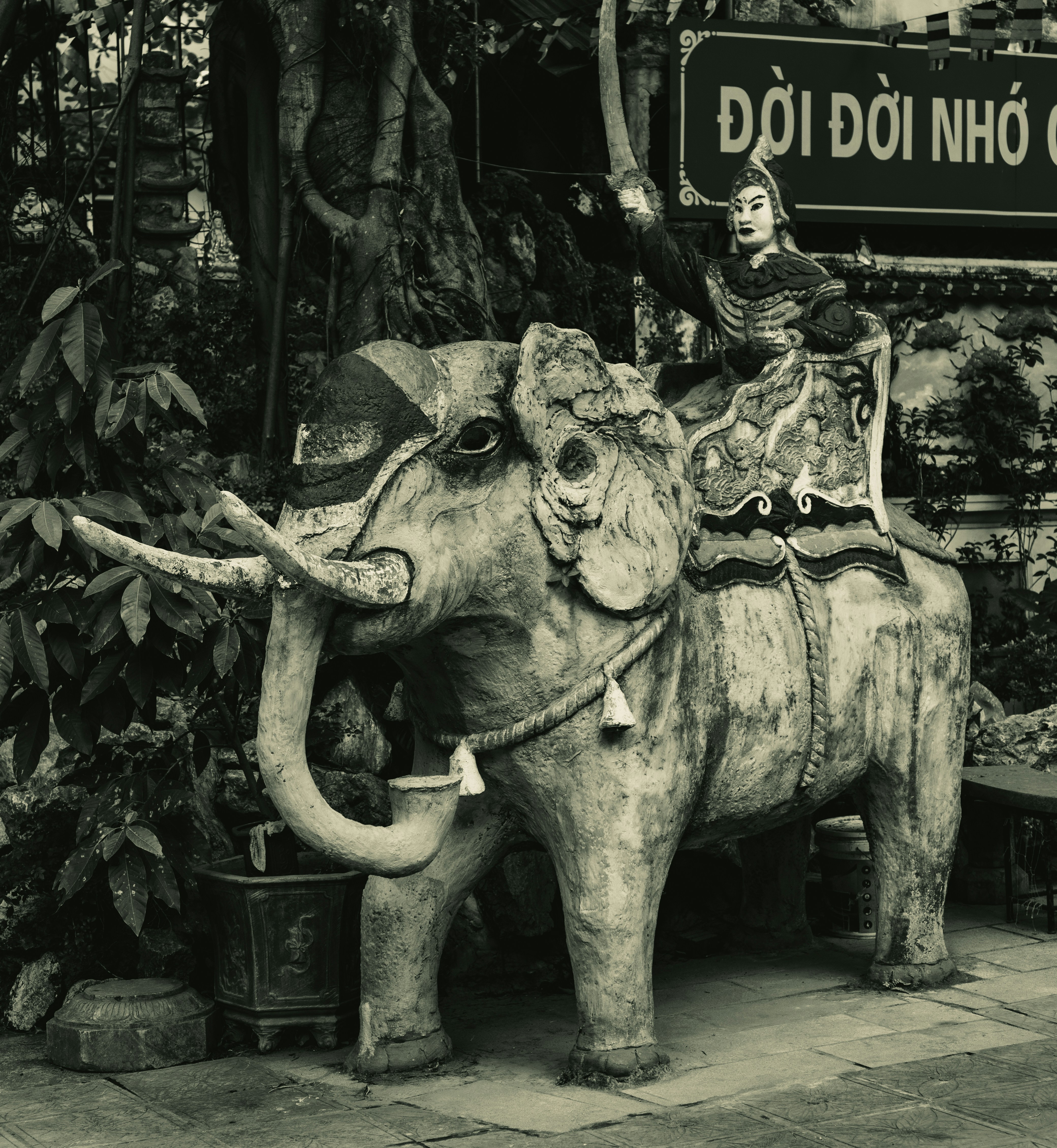 Stone Guardian: An Ancient Elephant Carriage in Quiet Monochrome