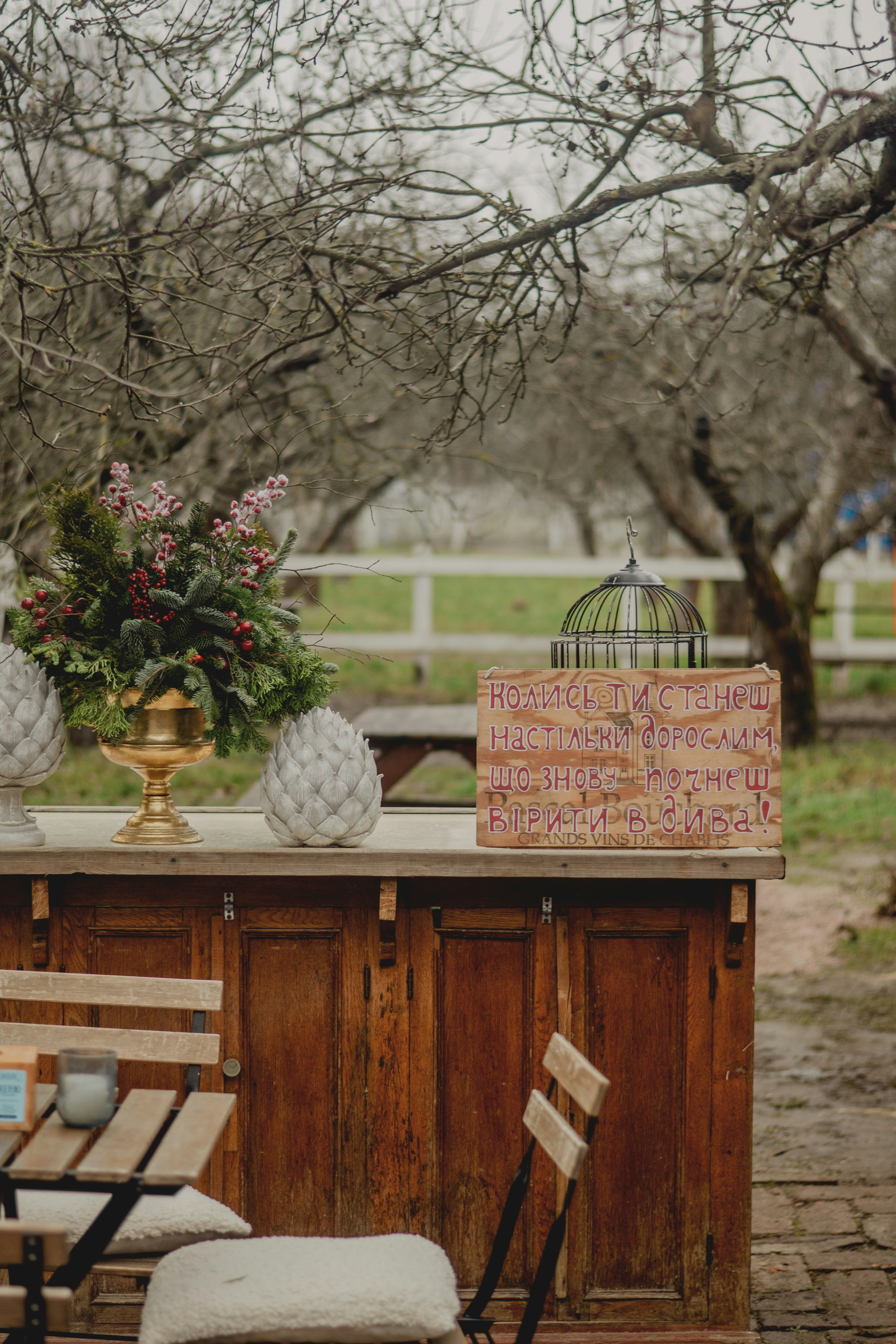 Charmed Market Stand with Floral Arrangements and Handwritten Sign