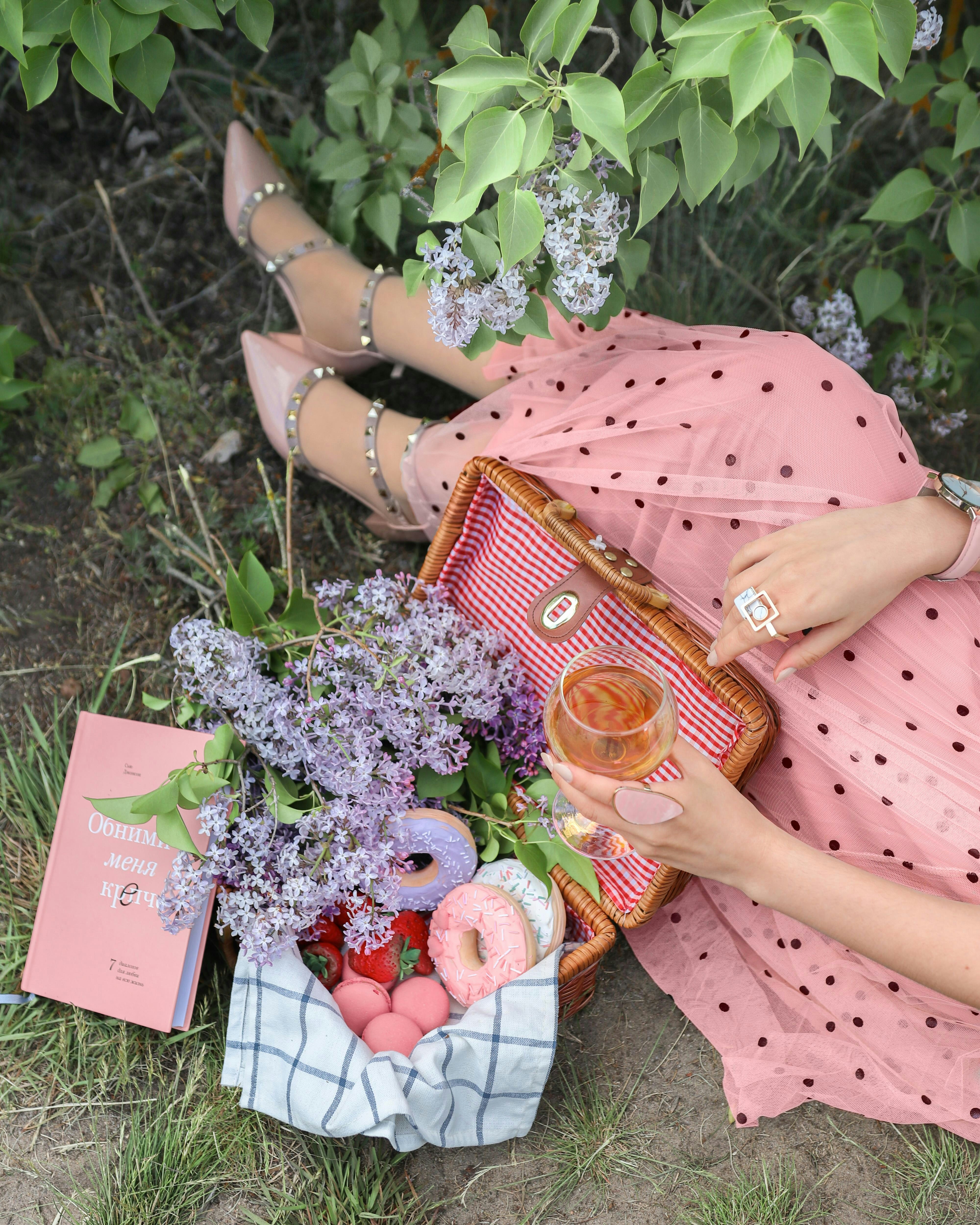 Pastel Picnic: Blooms, Pink Dress, and A Glass of Dawn