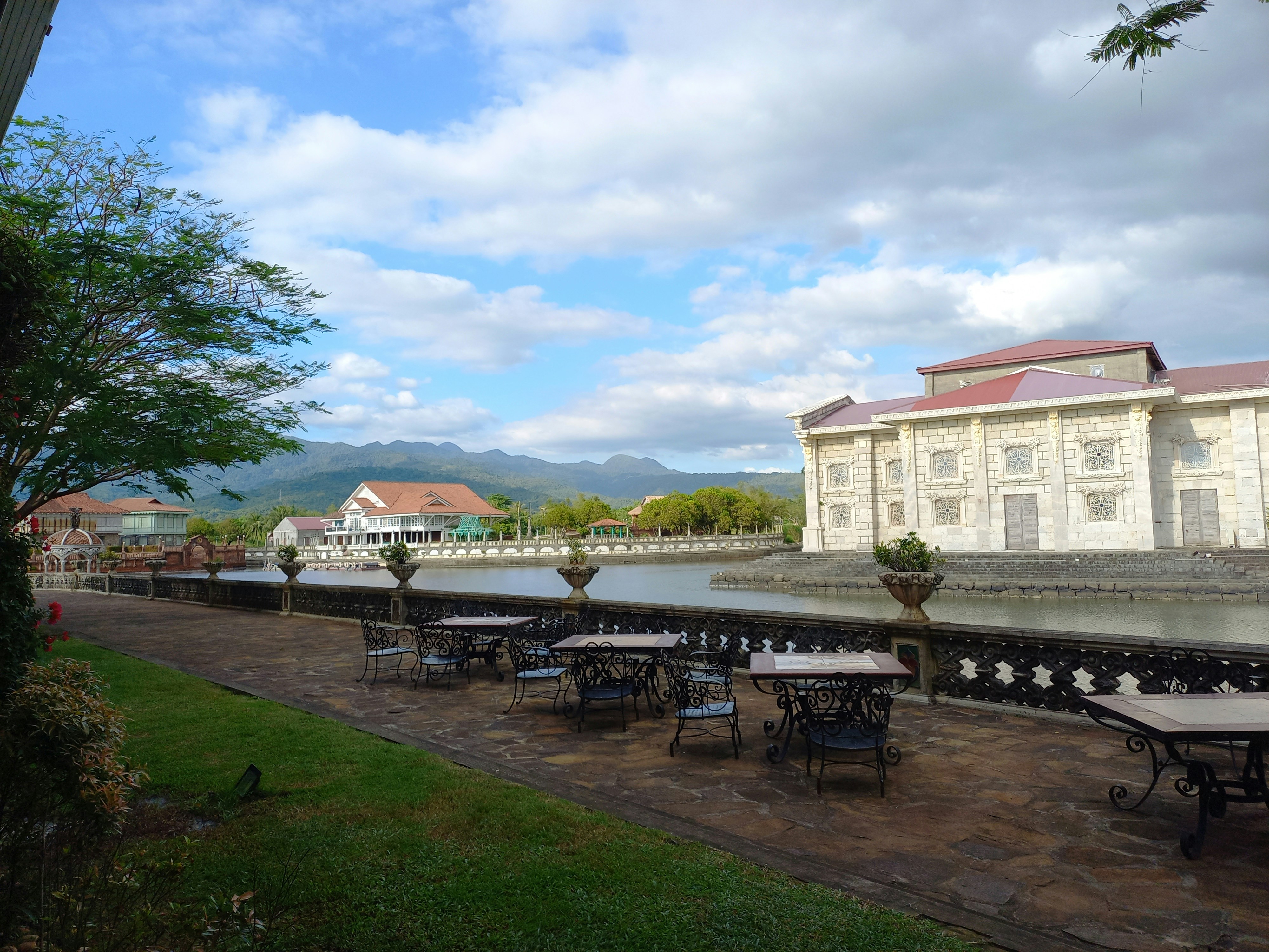 Ornate building beside a tranquil body of water