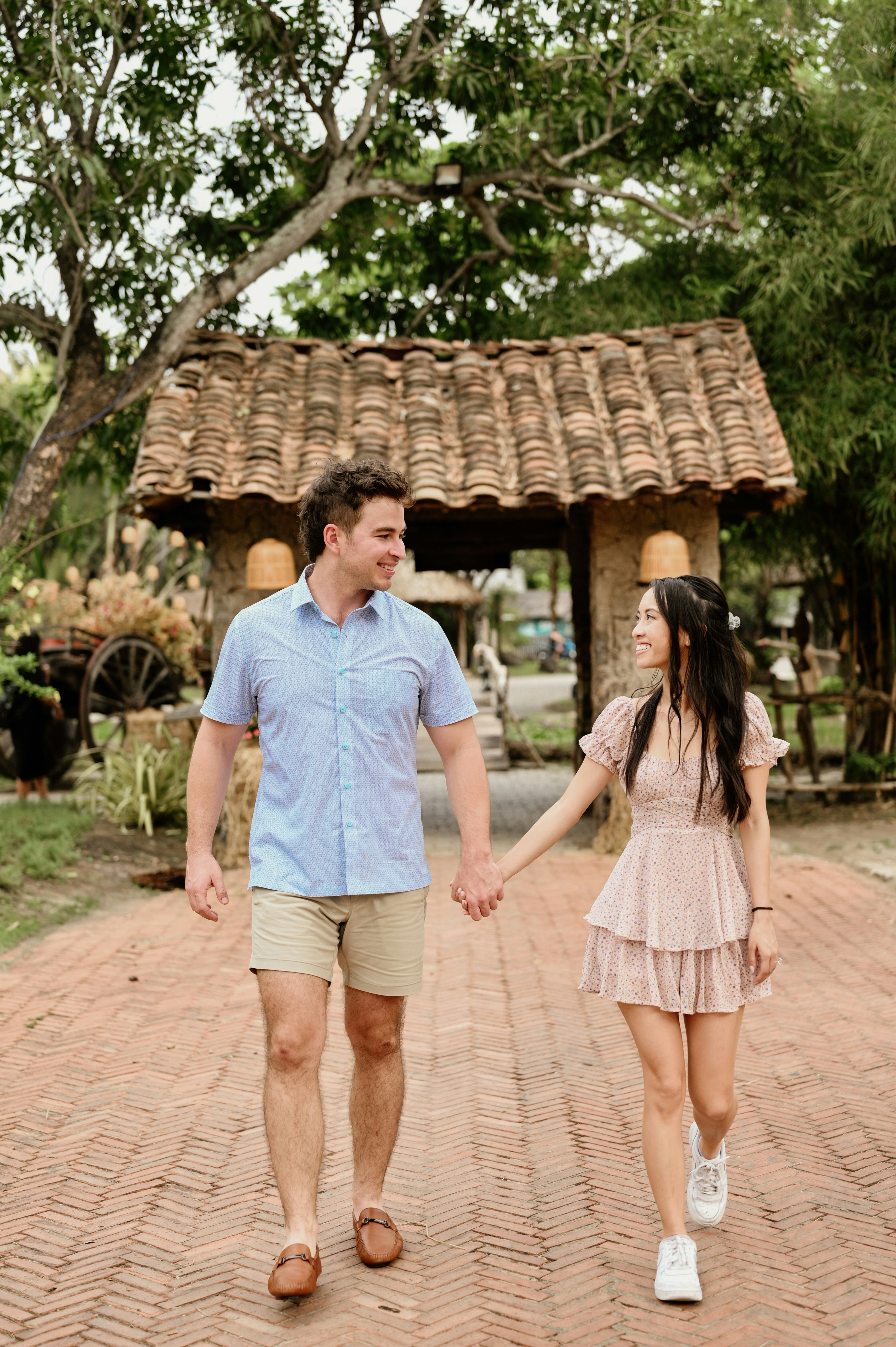 Holding Hands on the Brick Path: A Sunshine Day Outdoors