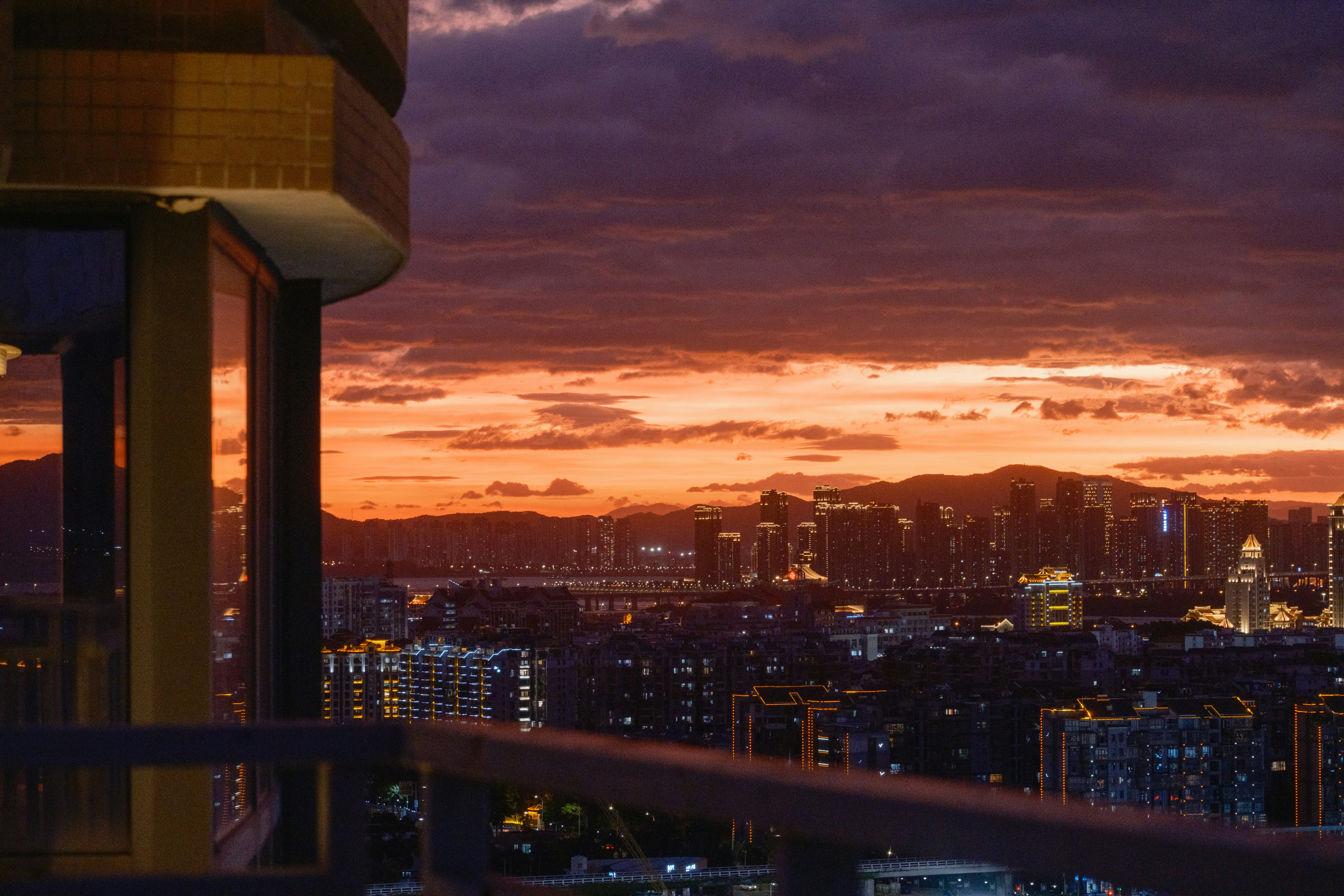 Edge of Dusk: City Lights Bleed into a Quiet Balcony