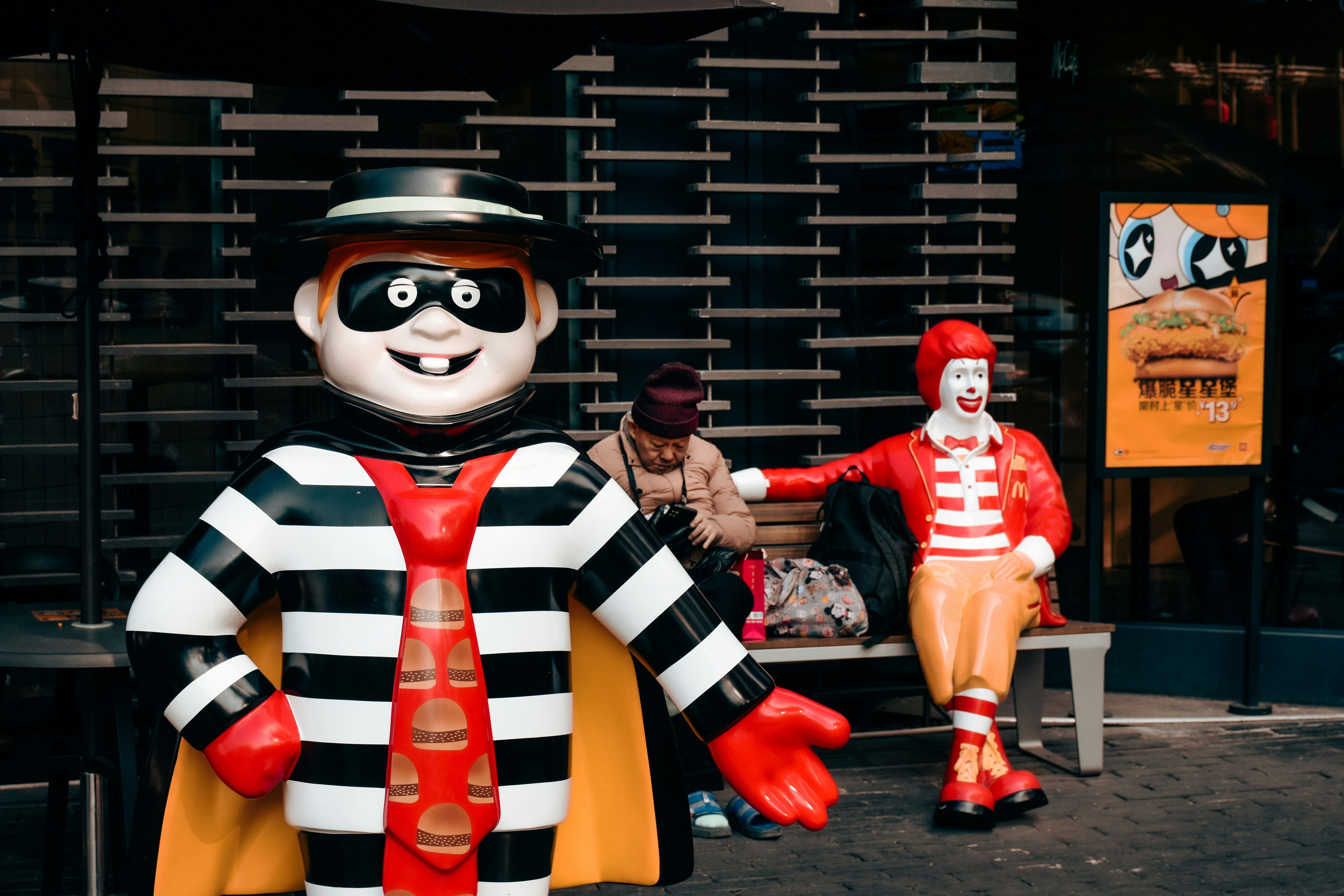 Street of Giggles: Inflatable Hosts under Neon Billboards
