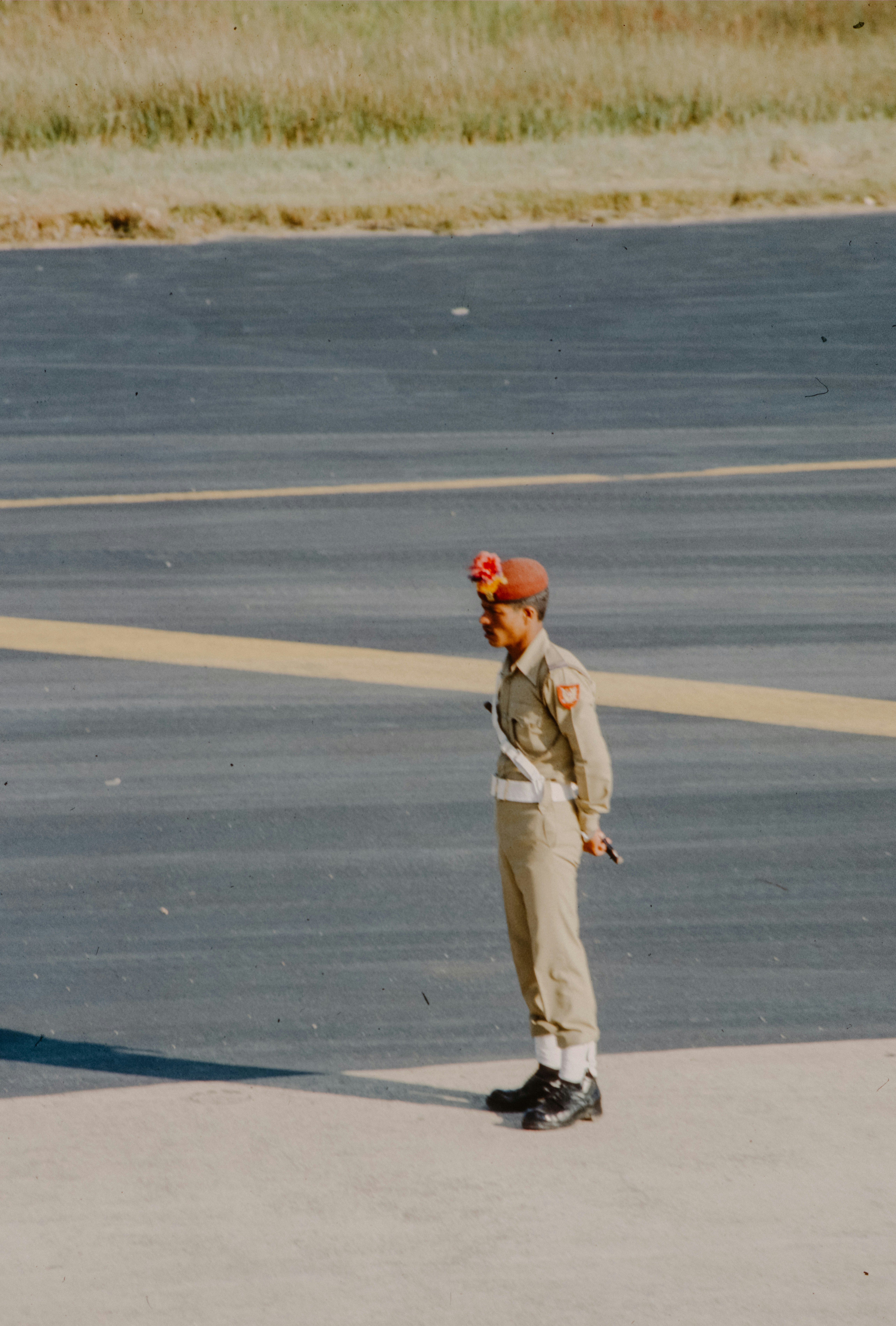 Stand at Attention: An Armed Guard on a Quiet Runway