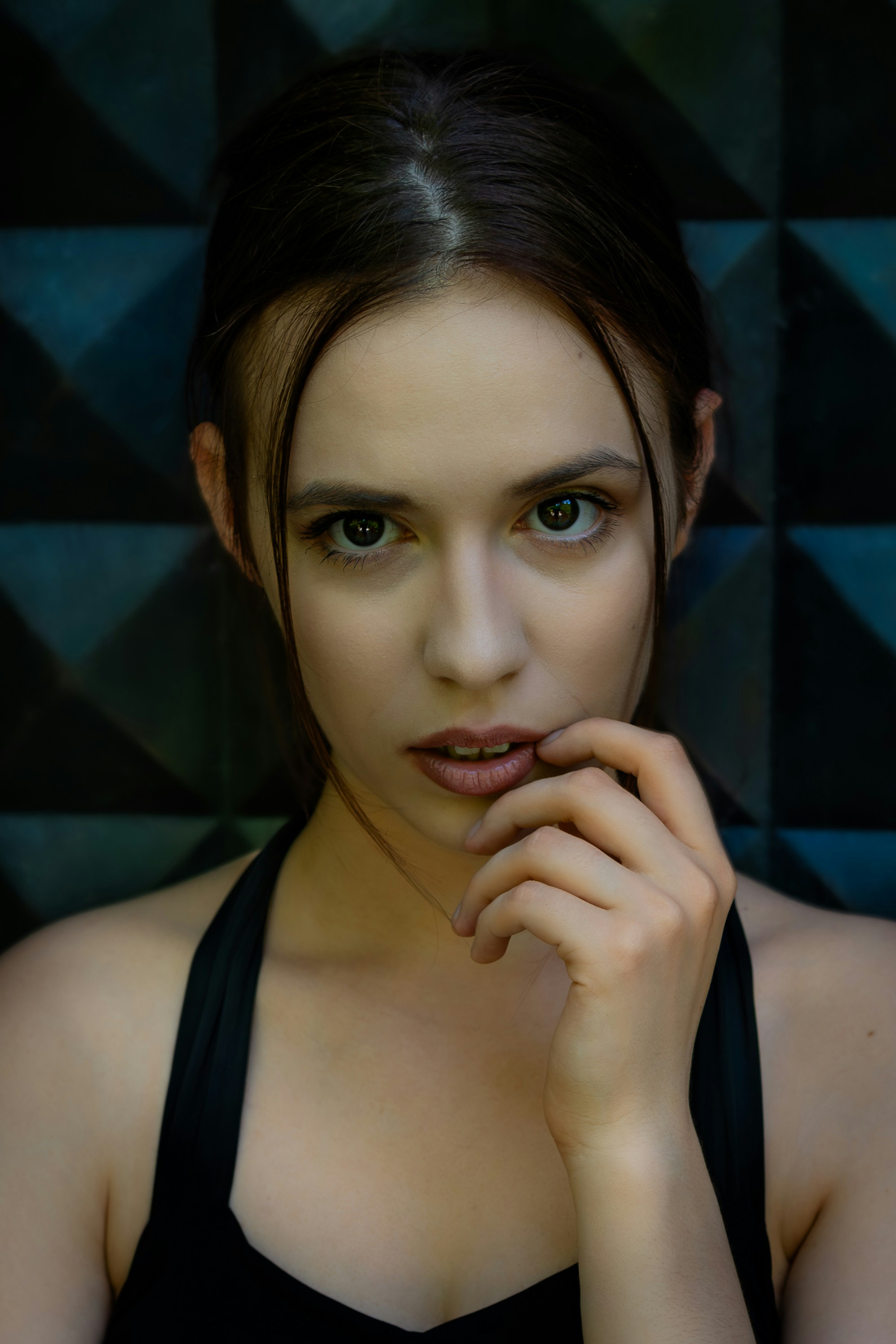 Eyes in Focus: Intimate Portrait Against Geometric Backdrop
