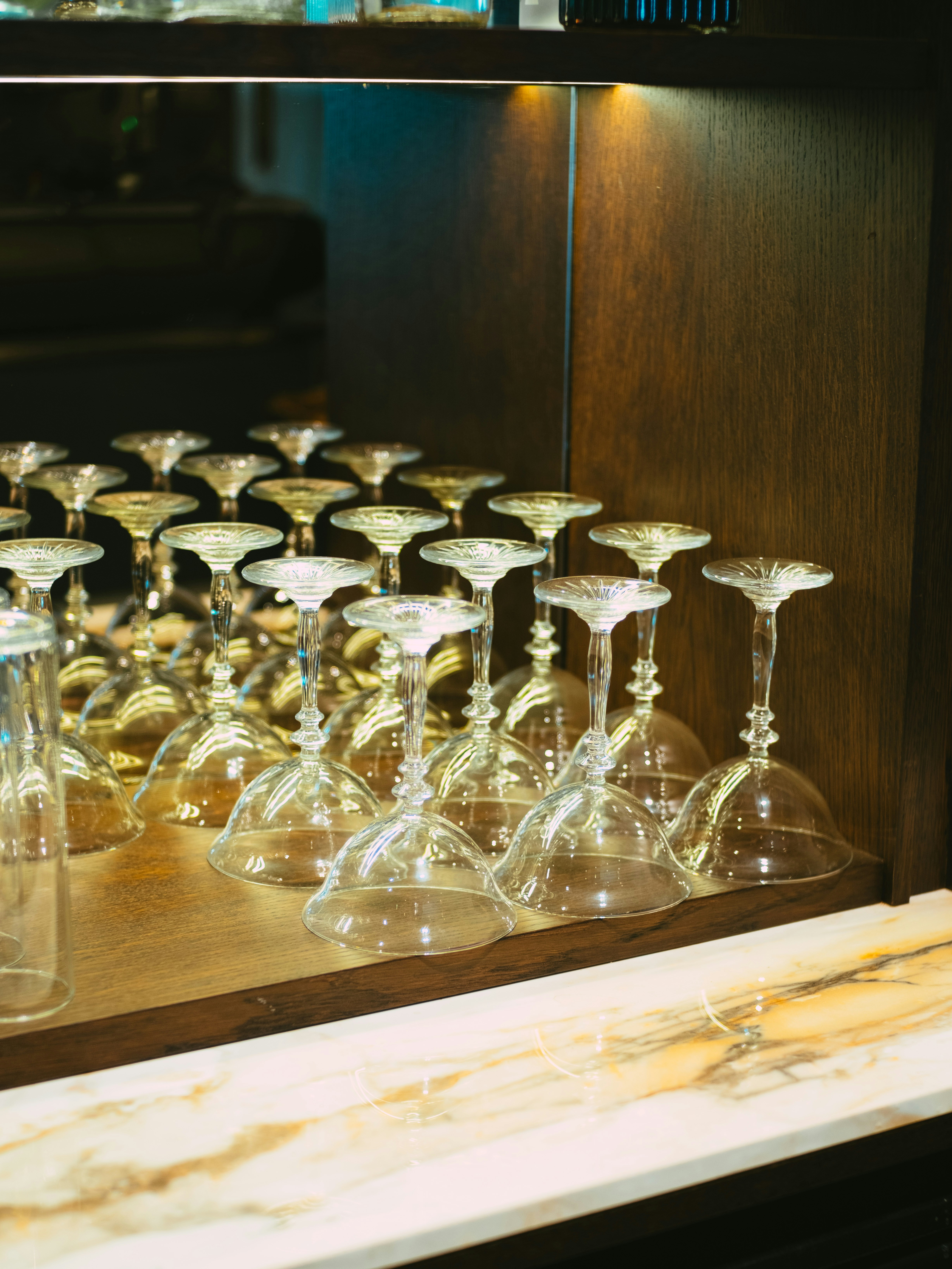 Glass Choir on a Bar Shelf