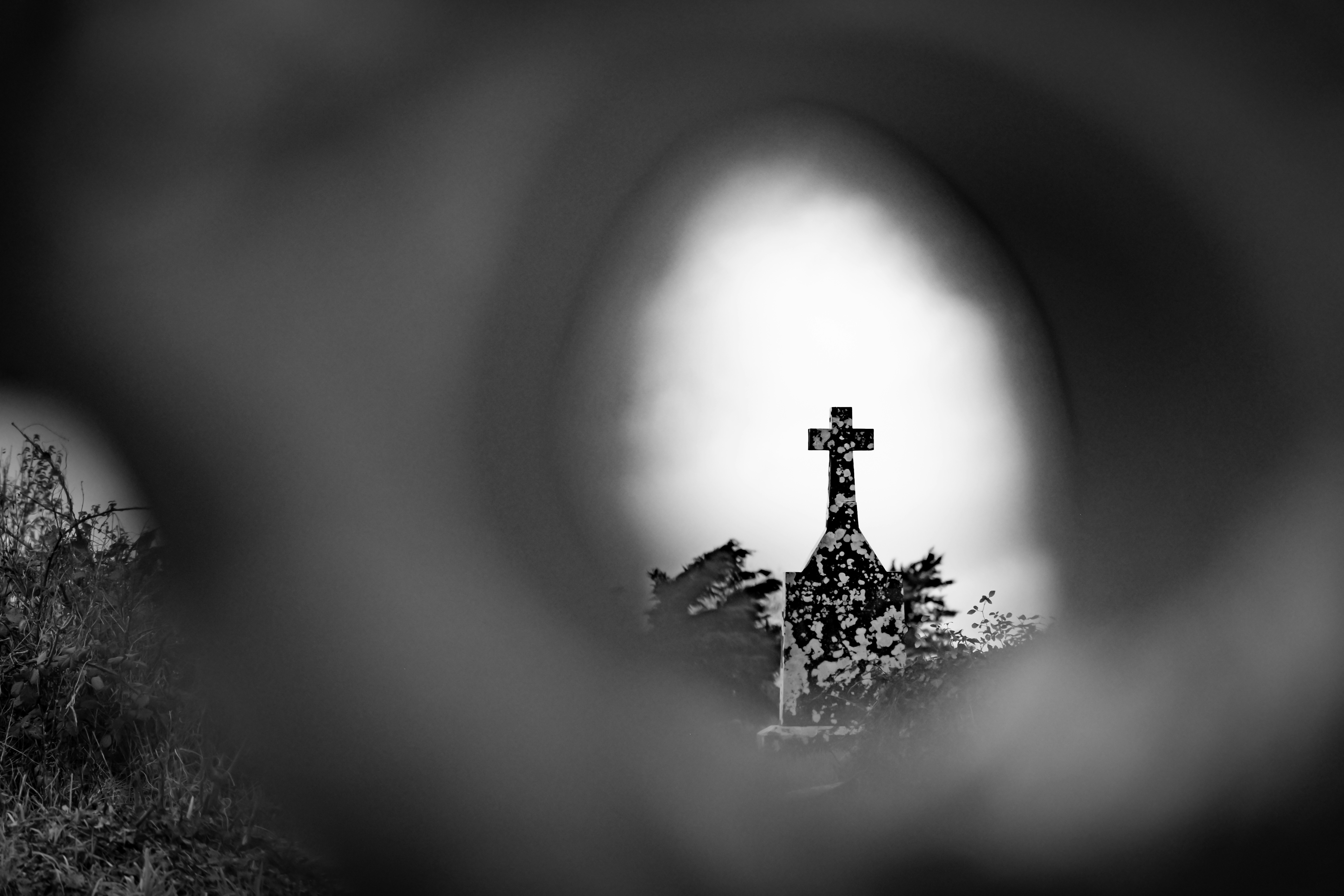 Cross in Focus: A Shrine Framed by the Dark Ring