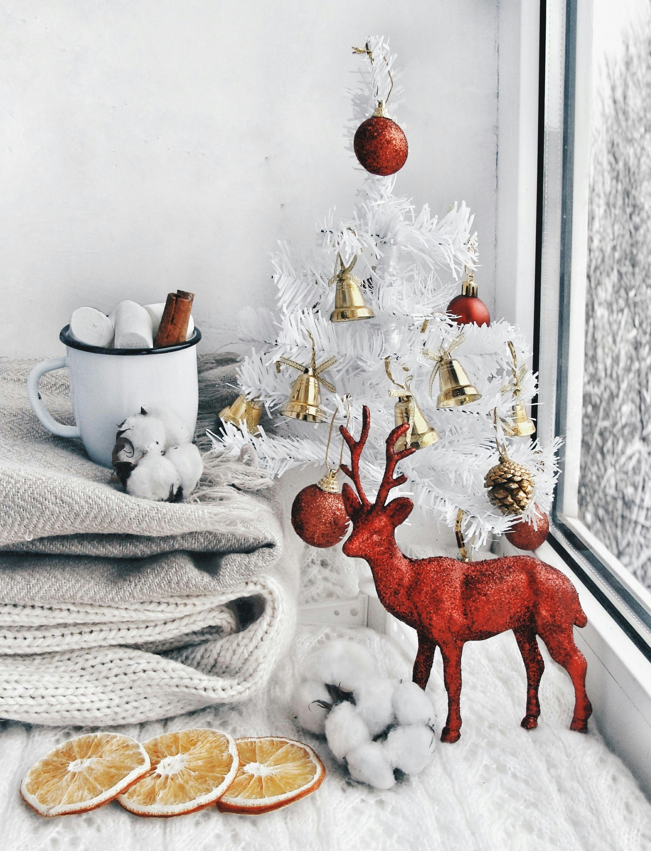 Red Stag Among Winter Ornaments by a Frosted Window