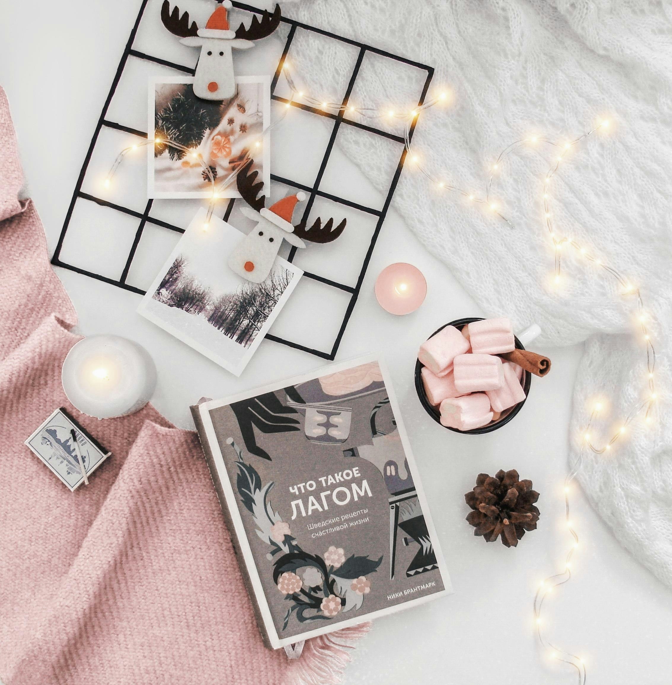 Cozy Winter Still-Life with Cardboard Book and Fairy Lights