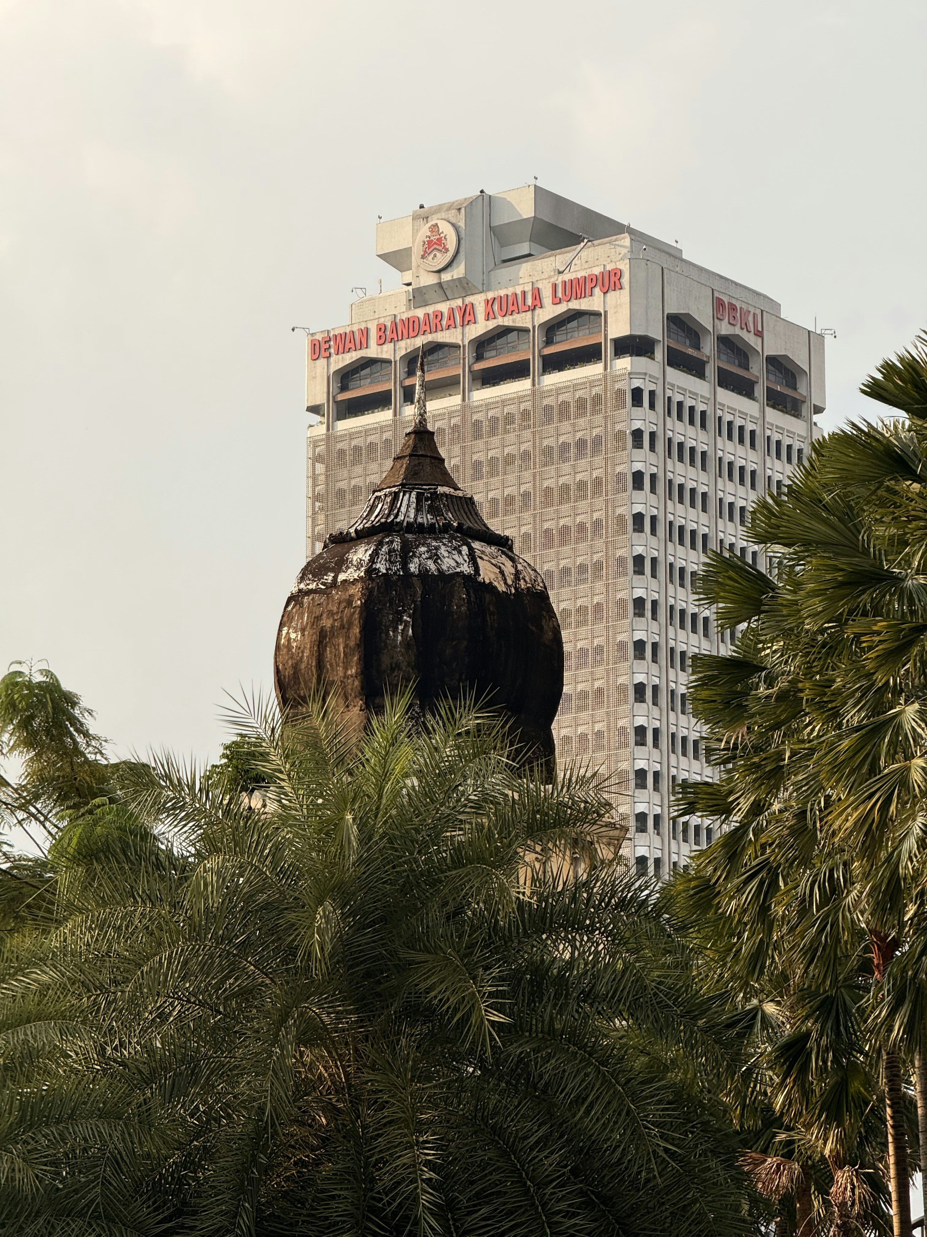 Crowned by a Dark Dome: Urban Heritage and Skyward Towers