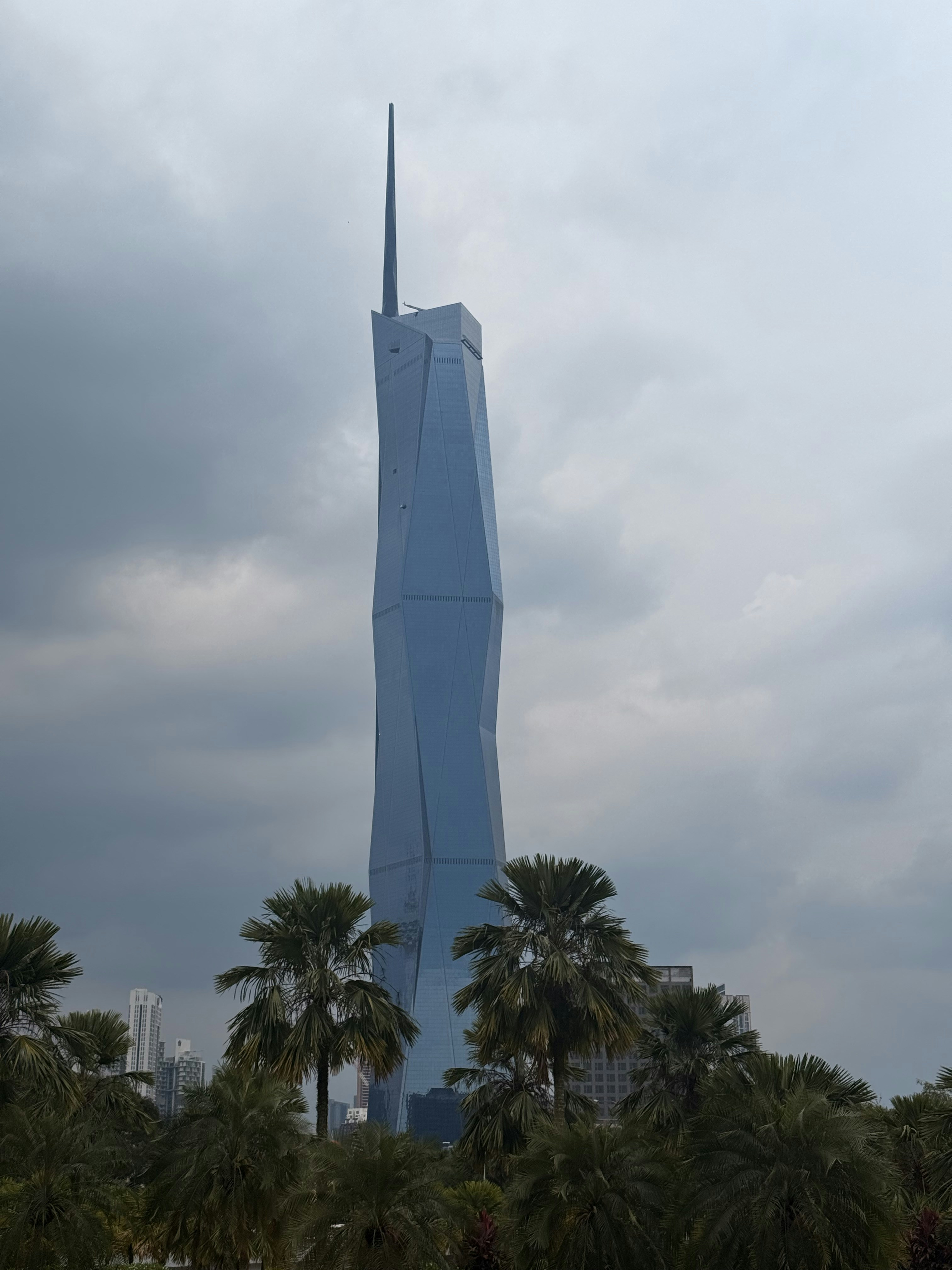 Blue Spire Rising Over Lime Treeline