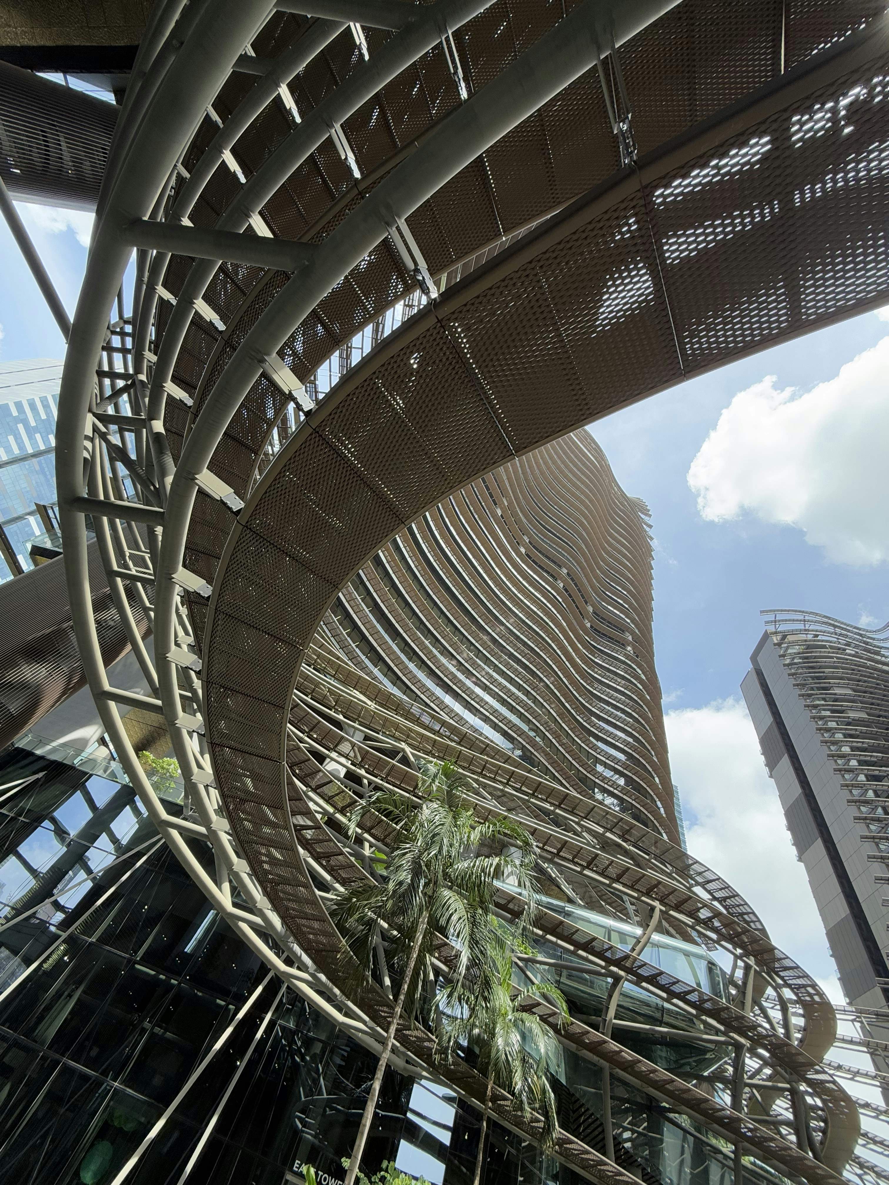 Woven Steel Helix: Curved Architecture Against a Sky