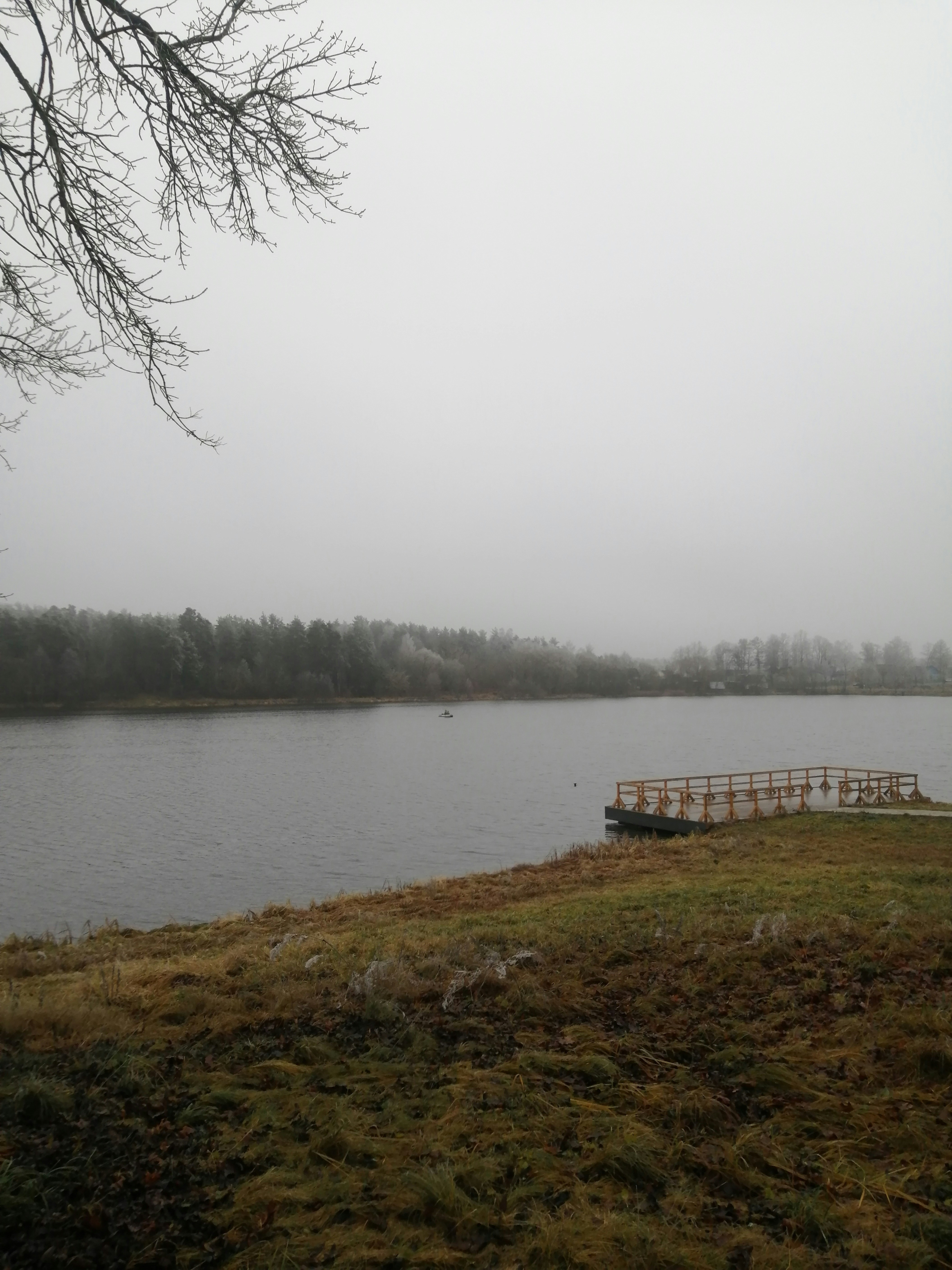 Mist over the Quiet Lake with a Distant Pier
