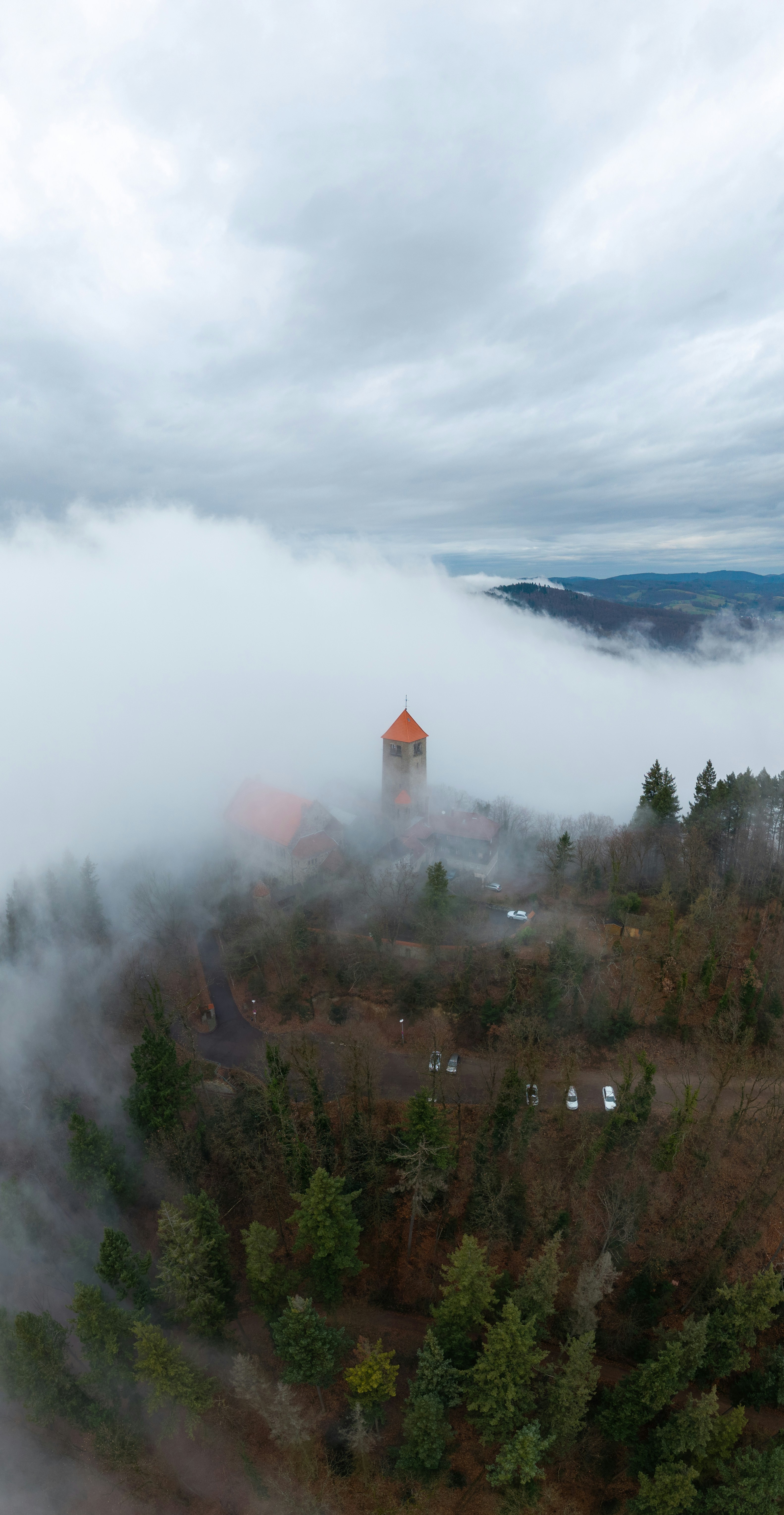 Fog-Lorn Bell Tower: A Tower Emerges Through Cloud Mist