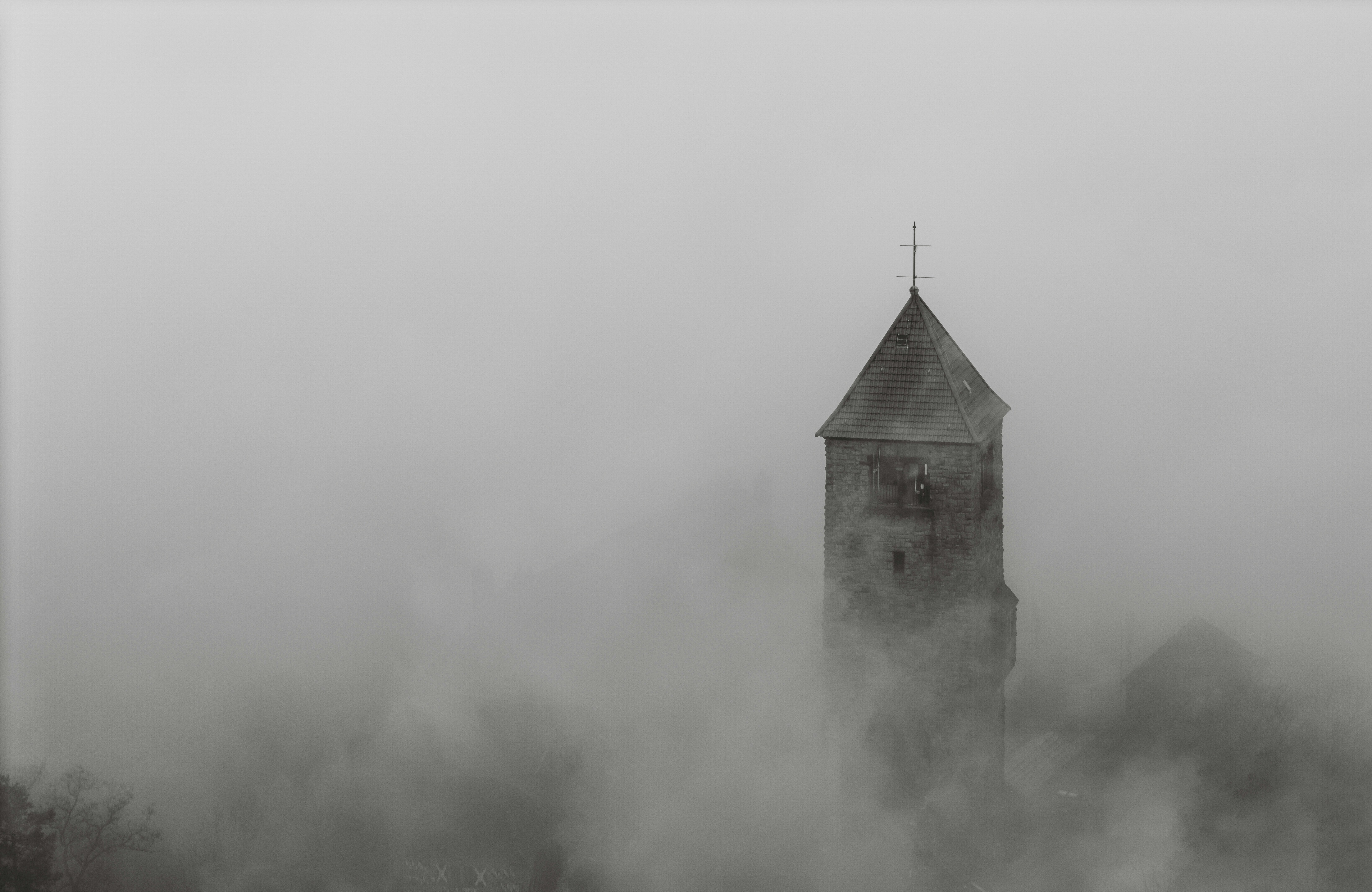 Tower Emerges Through Fog: A Lonely Bell-Tower in Mist