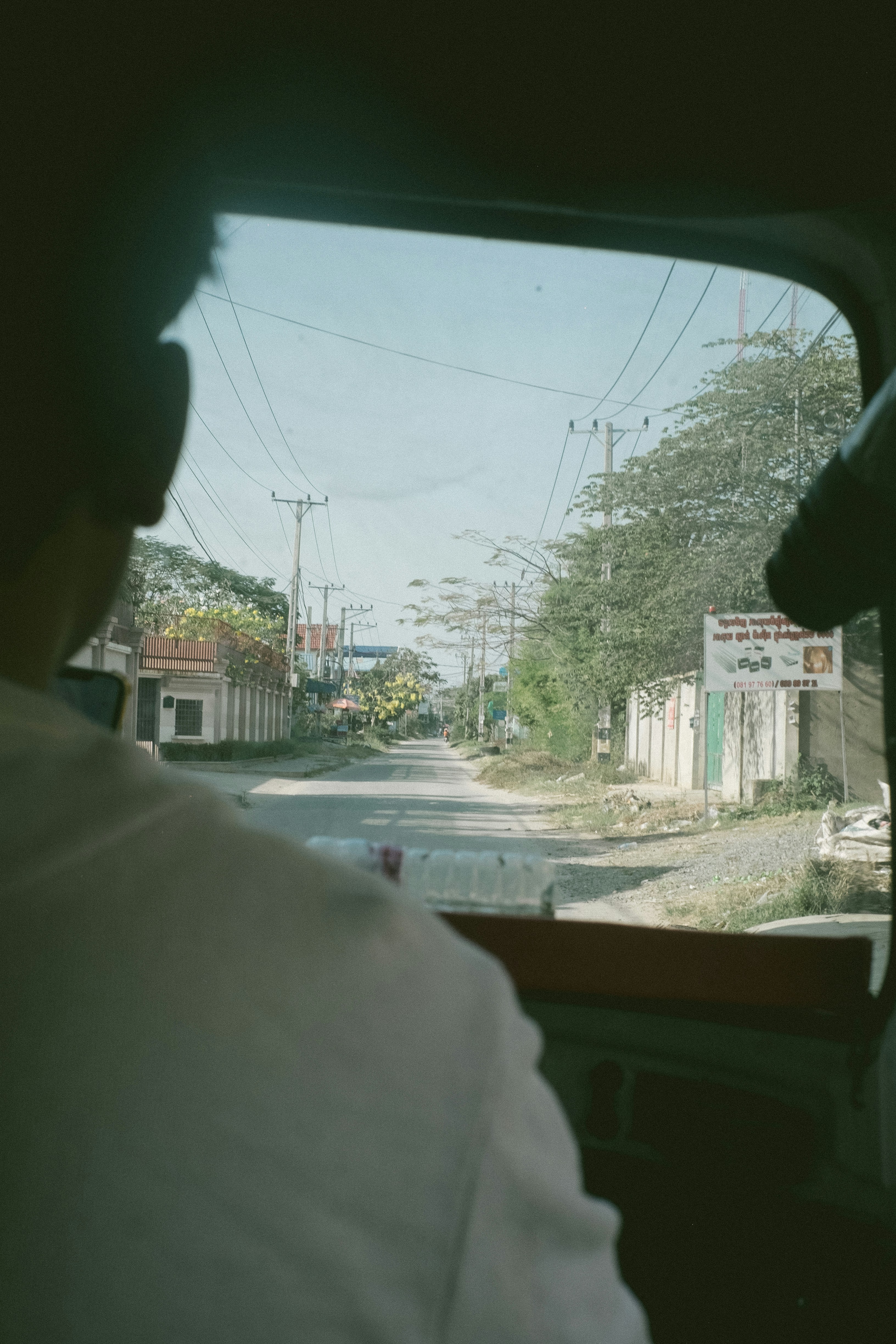 Front Seat Portrait: Street View Framed by Vehicle Window