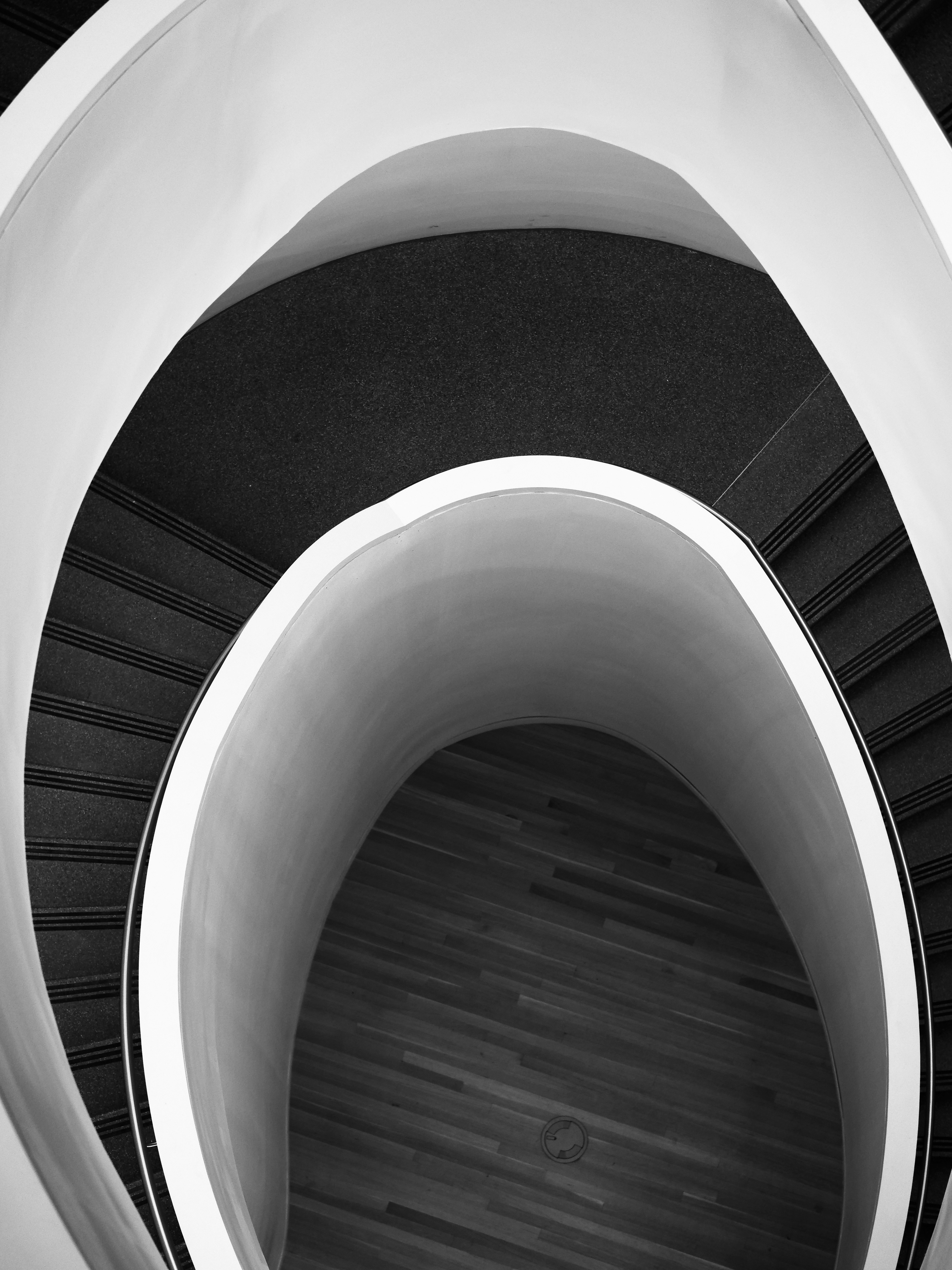Spiral Ascent: An Abstract Staircase in Monochrome