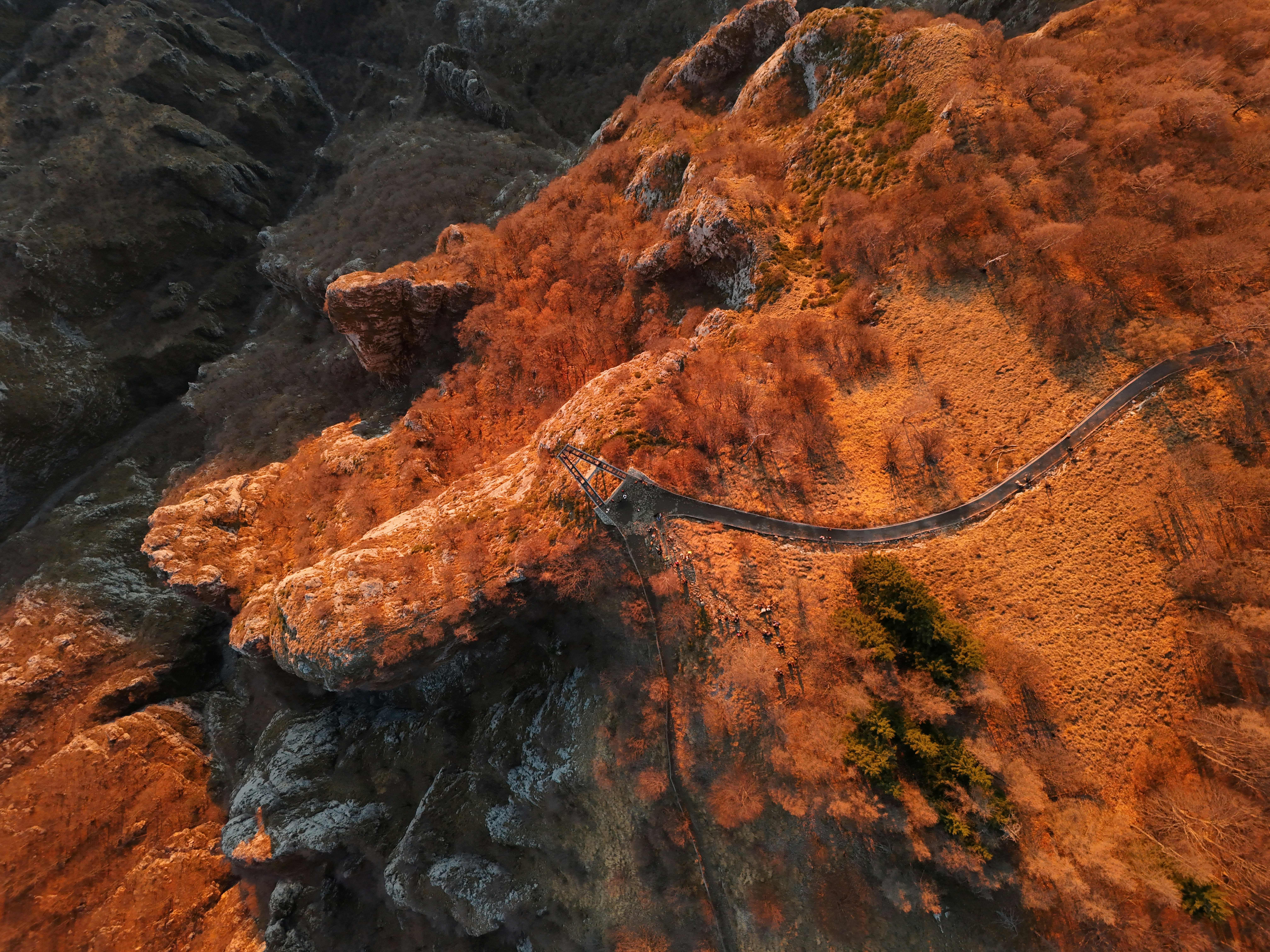 Copper Gorge: A winding staircase of cliffside trail curling through fiery rock
