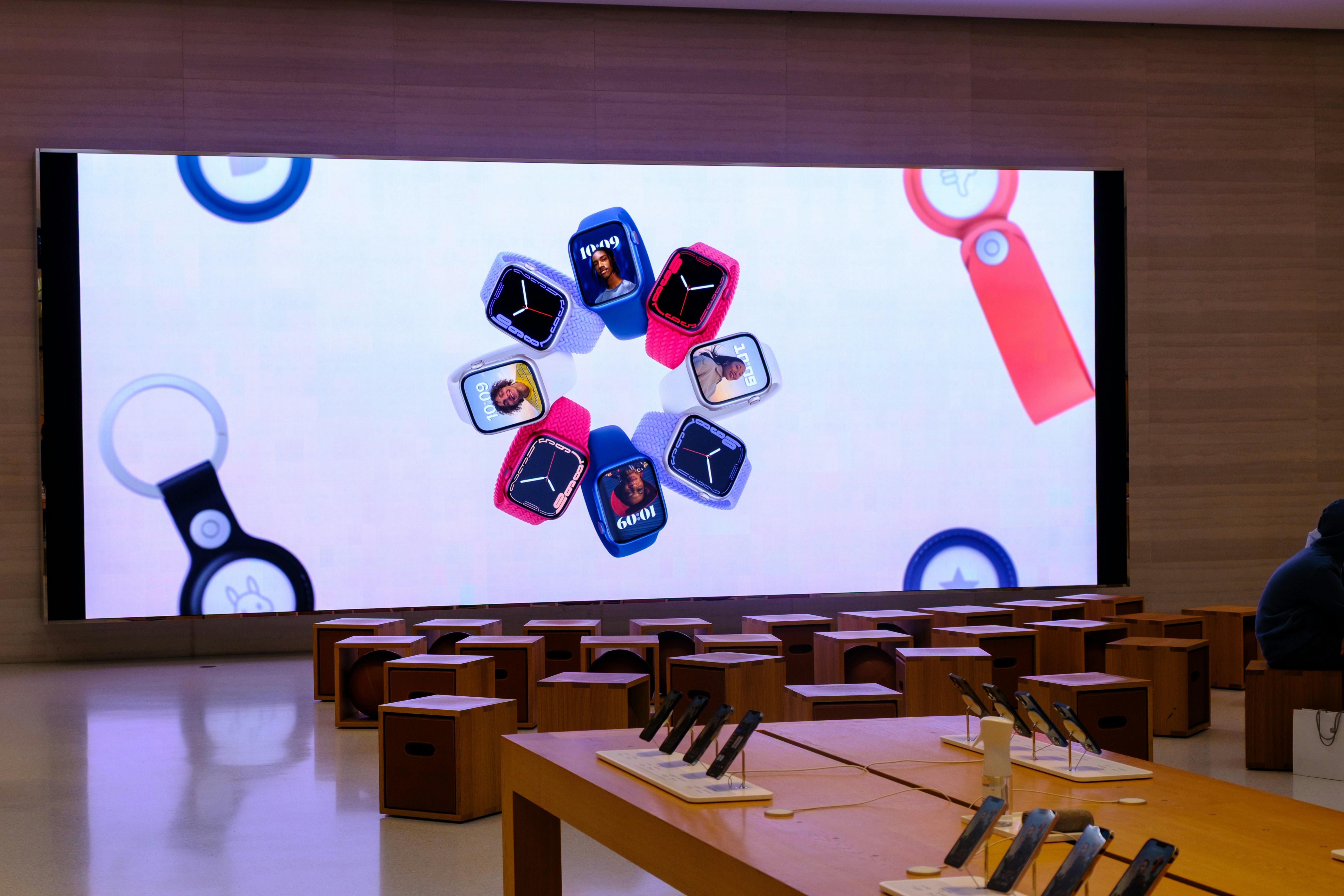 Smartwatches displayed on a large screen photo – Free Technology Image ...
