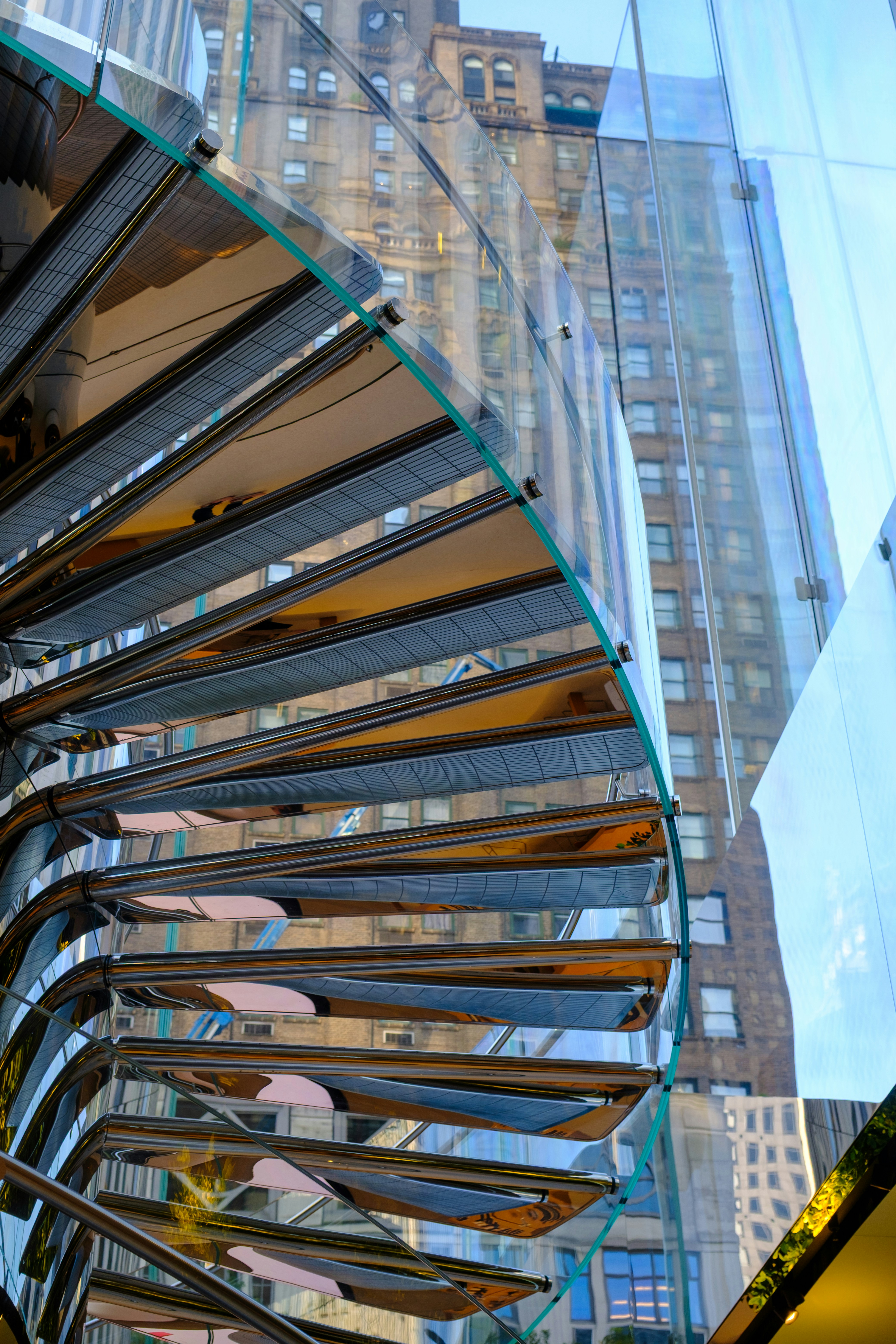 Spiral Staircase in Glass Facade: Urban Geometry in Motion