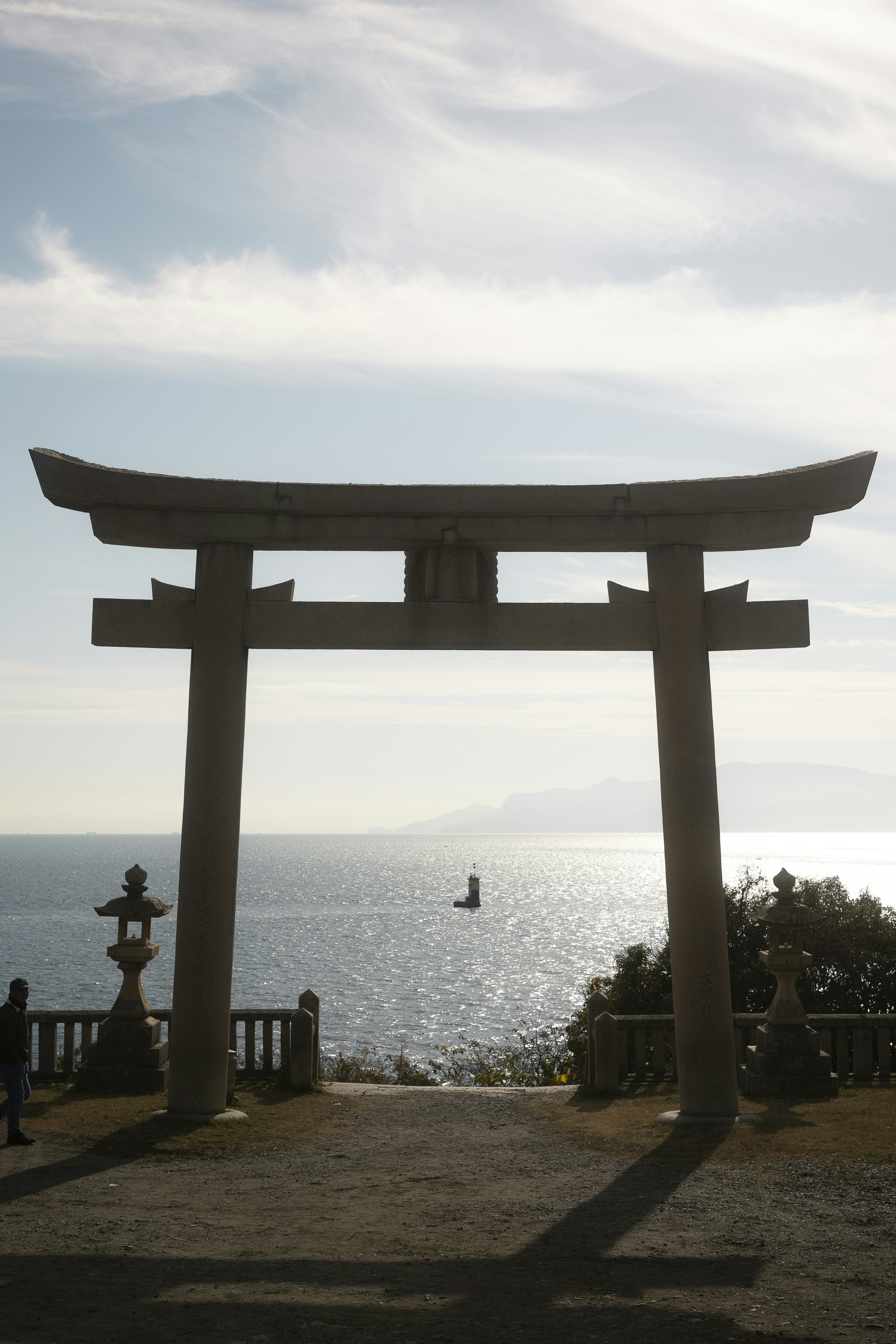 Torii Over the Sea: A Quiet Sea-Swept Moment at Sunset