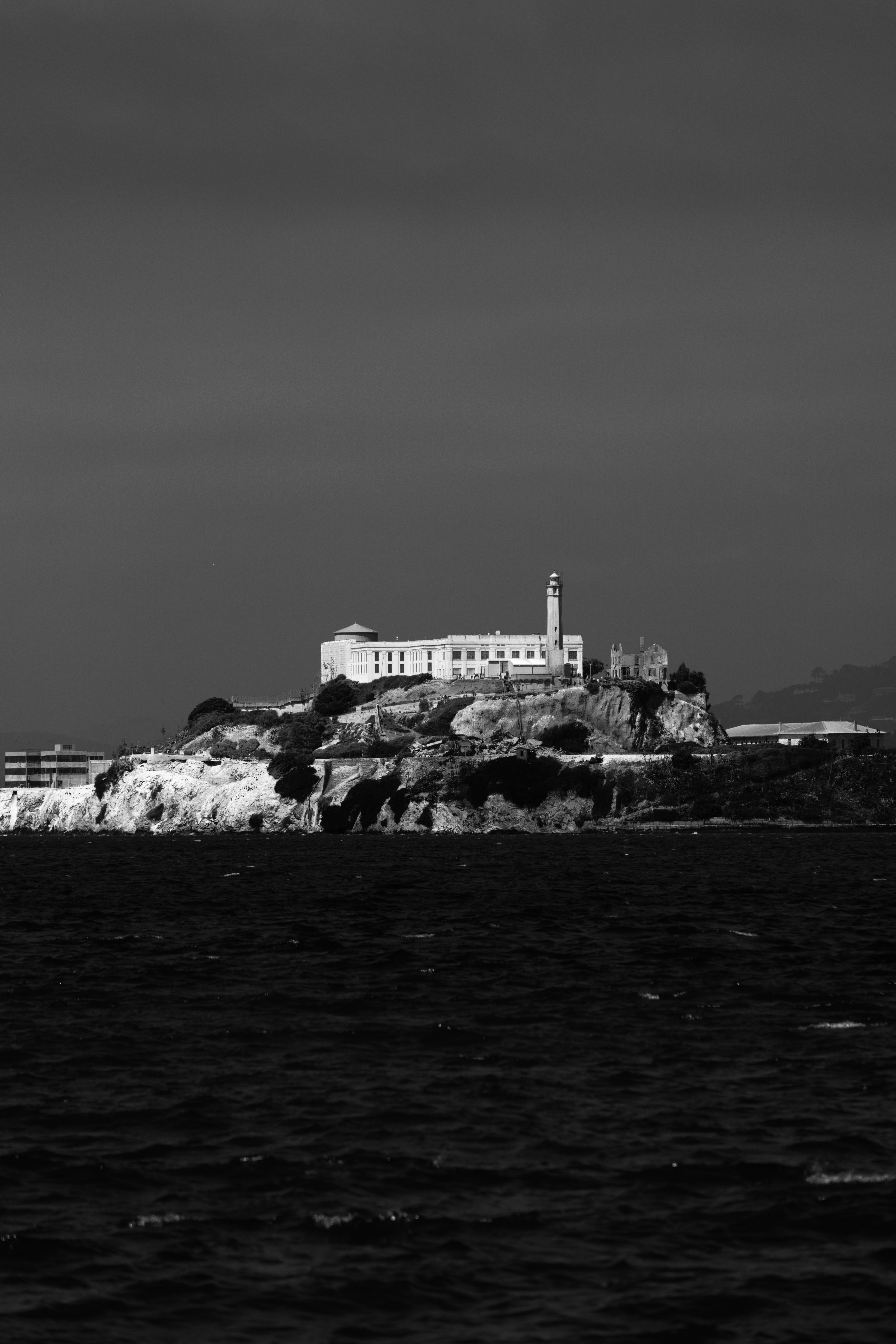Lighthouse Over the Cliff: A Monochrome Sentinel