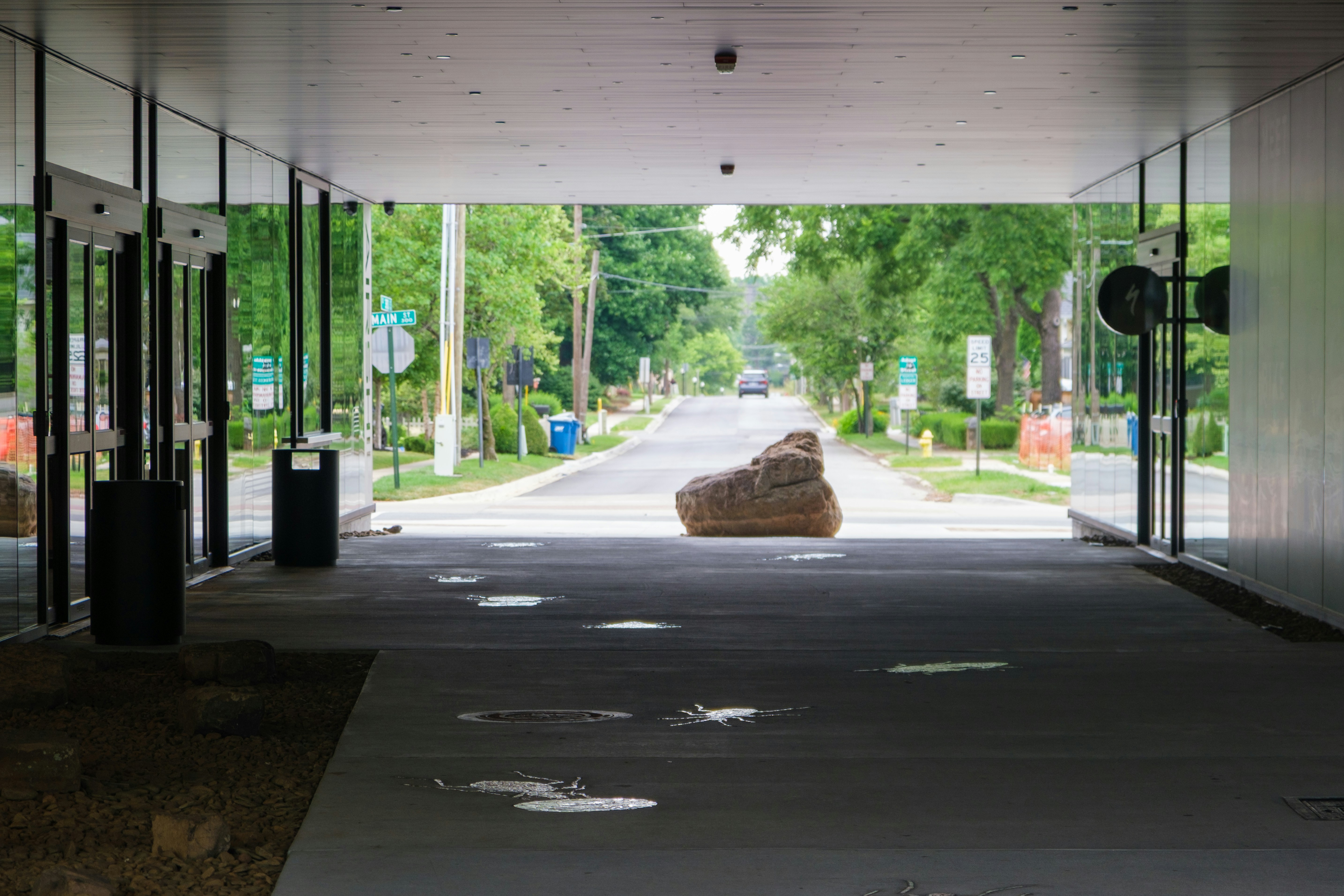 Underpass of Quiet Urban Corridor: A Solitary Boulder at Distant Street